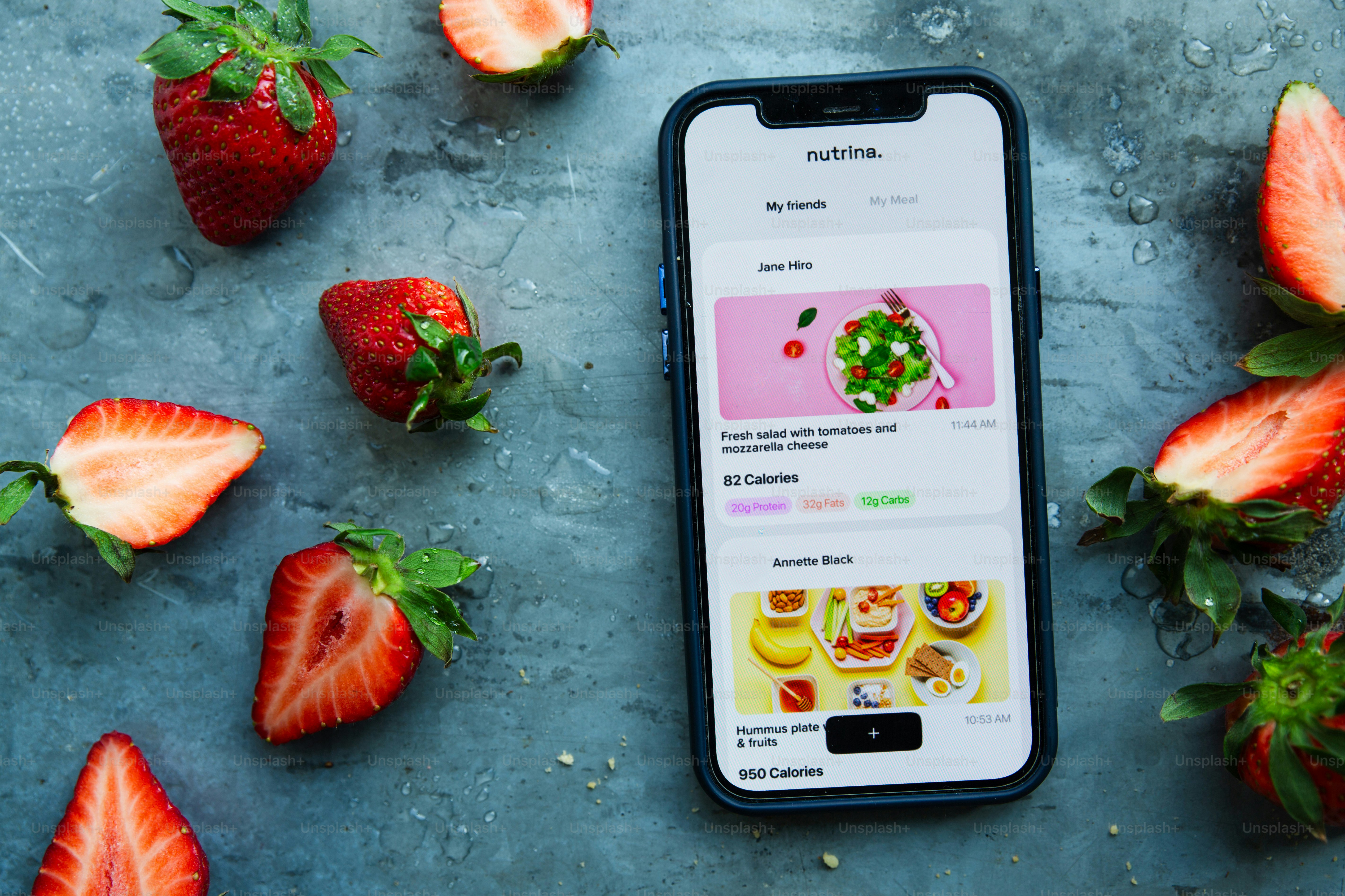 Smartphone with food app, surrounded by strawberries. photo – Tech ...