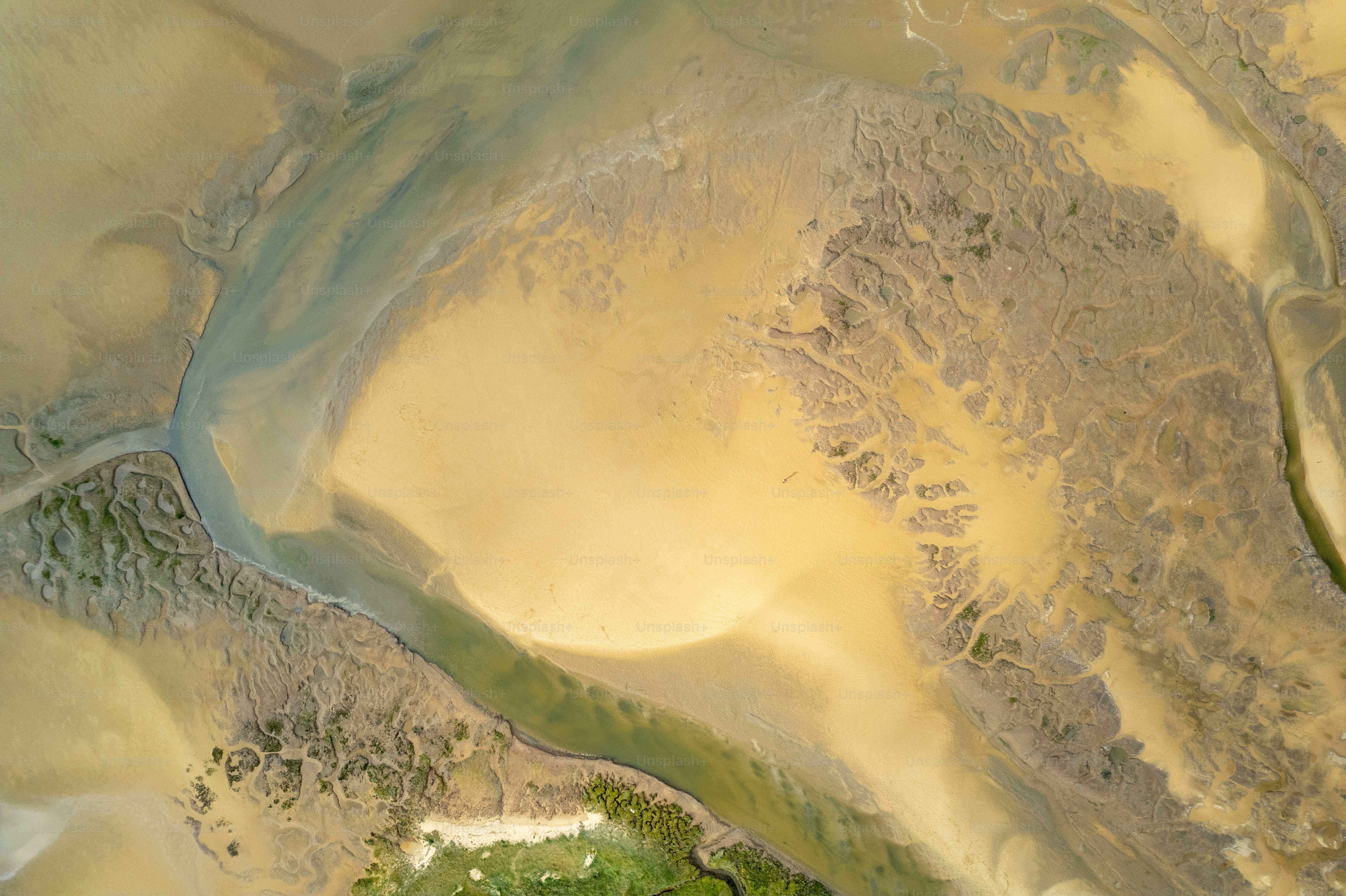 Tidal sand and water create an abstract landscape. photo – Wallpaper ...