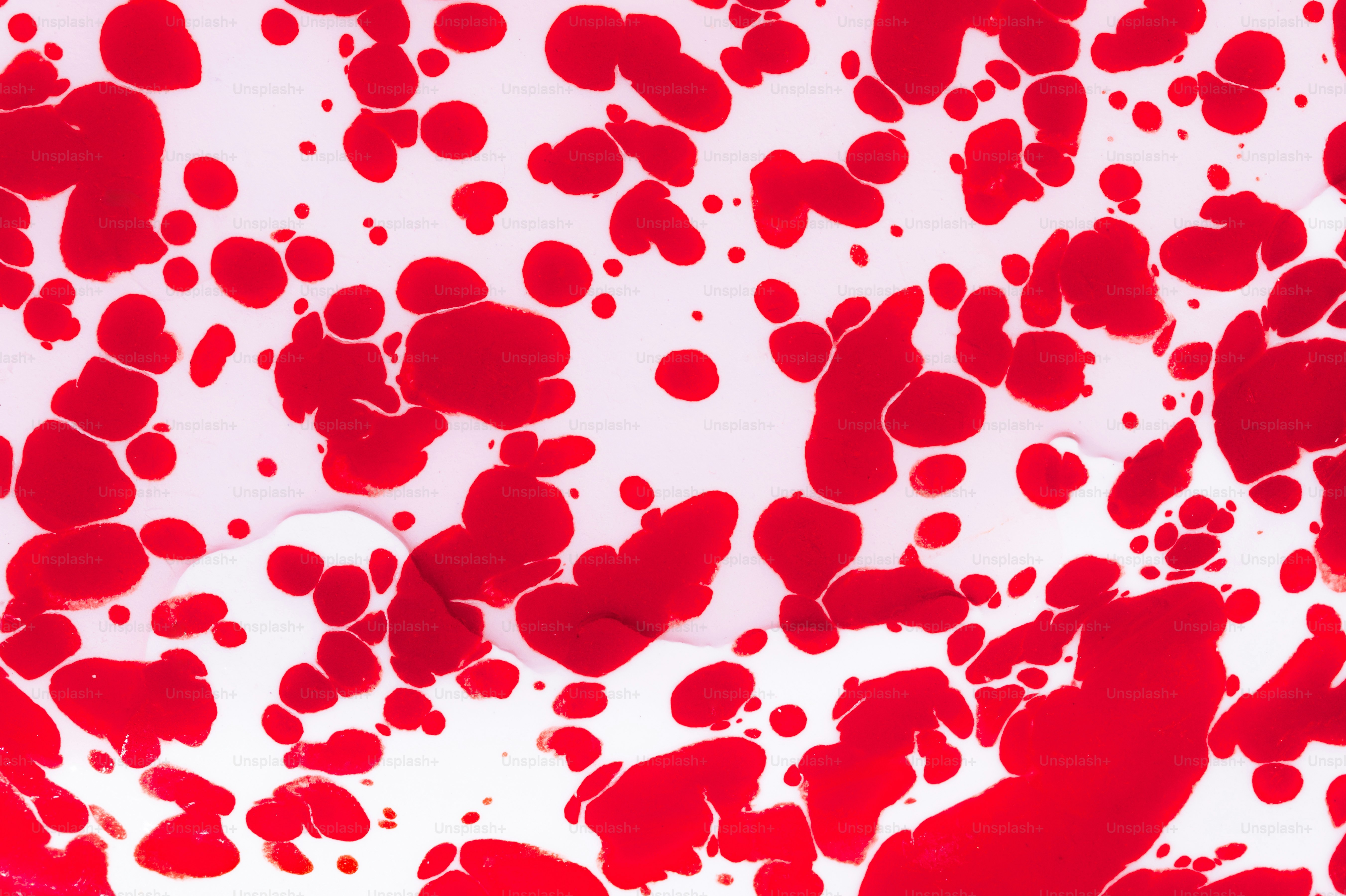 Red blobs against a white background create a cool pattern. photo ...