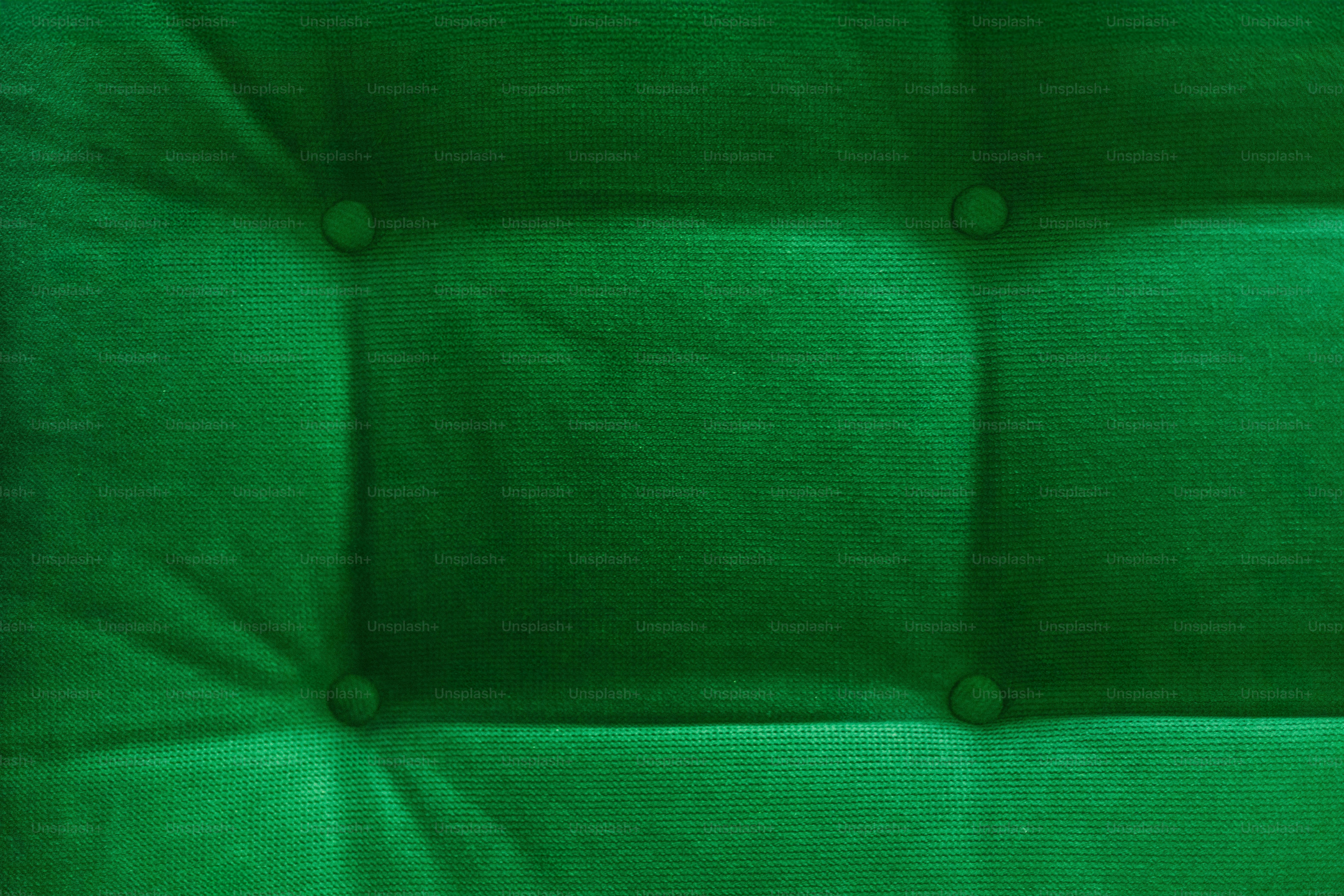A close-up view of a green, padded surface. photo – Wallpaper Image on ...