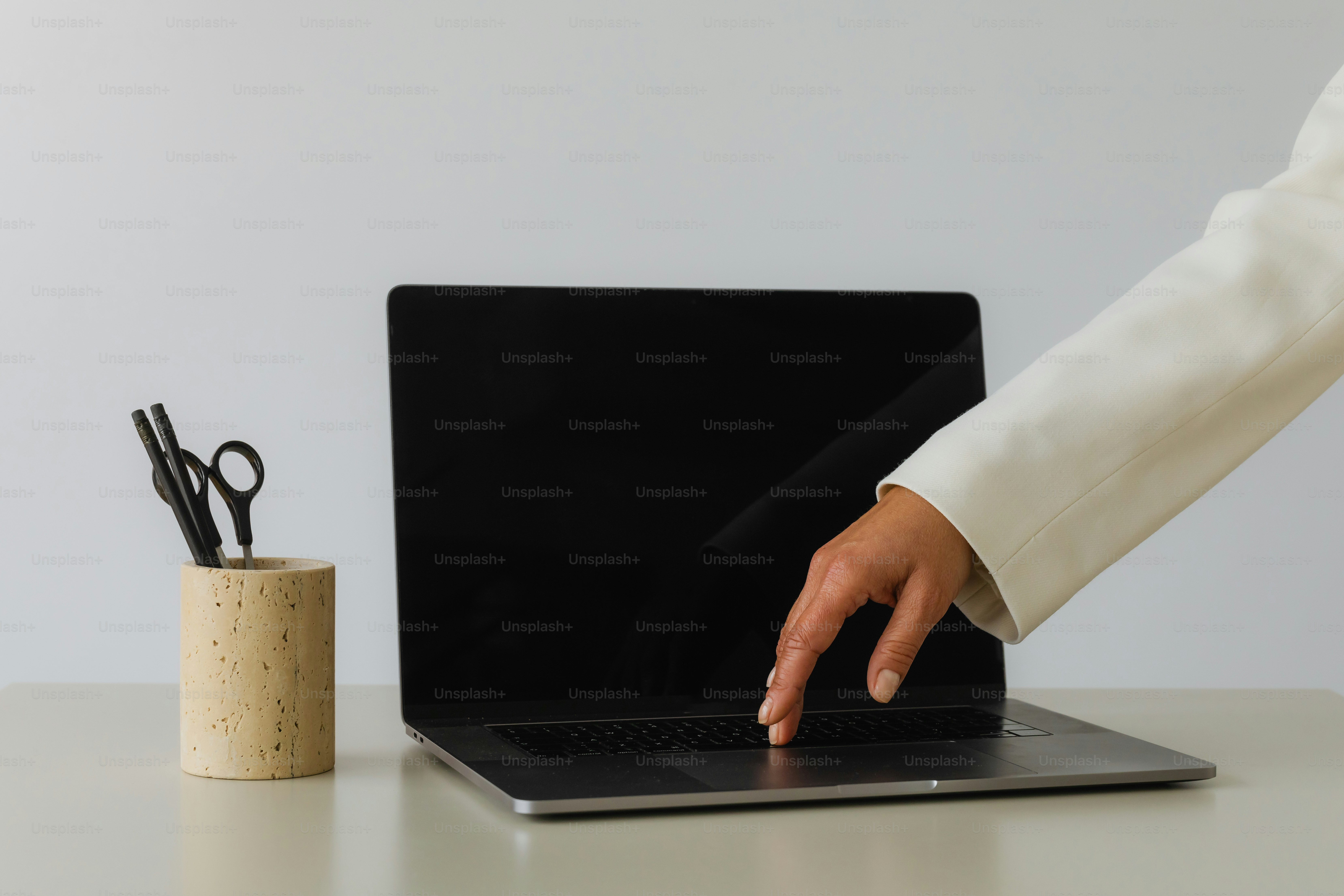 A person's finger touches the laptop's touchpad. photo – Technology ...