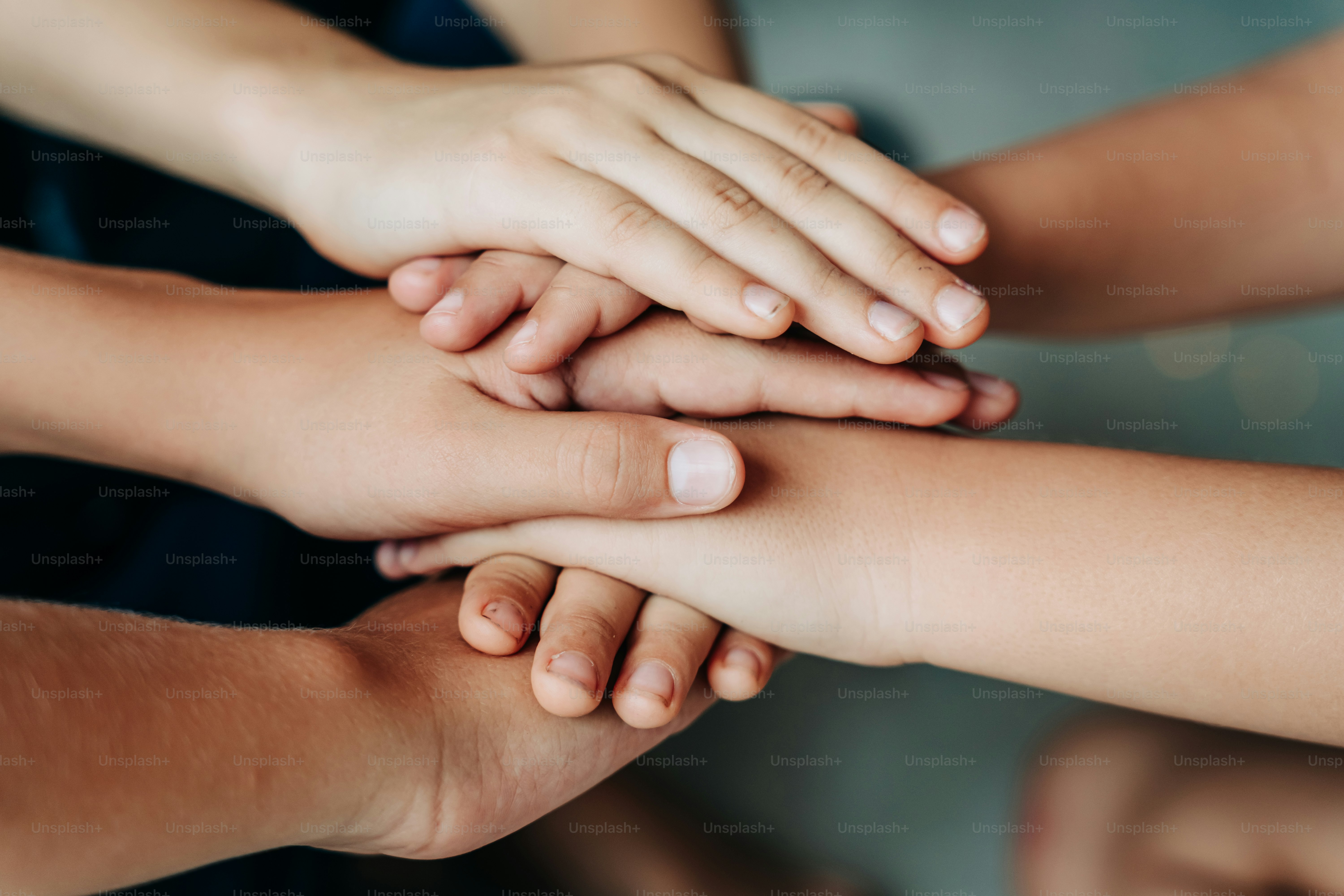 Hands together, showing unity and support. photo – Hands Image on Unsplash