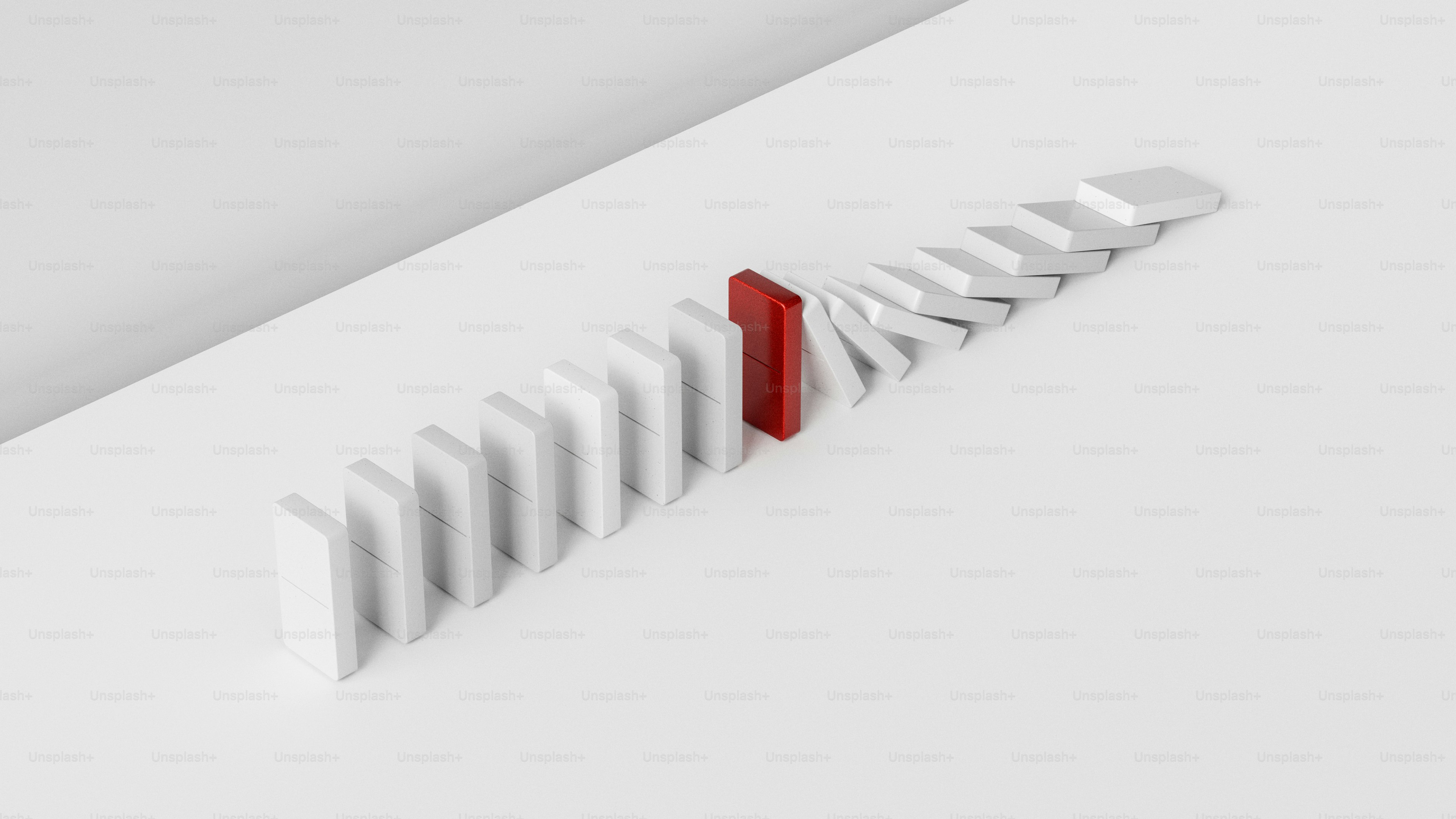Domino effect caused by a red domino. photo – Background Image on Unsplash