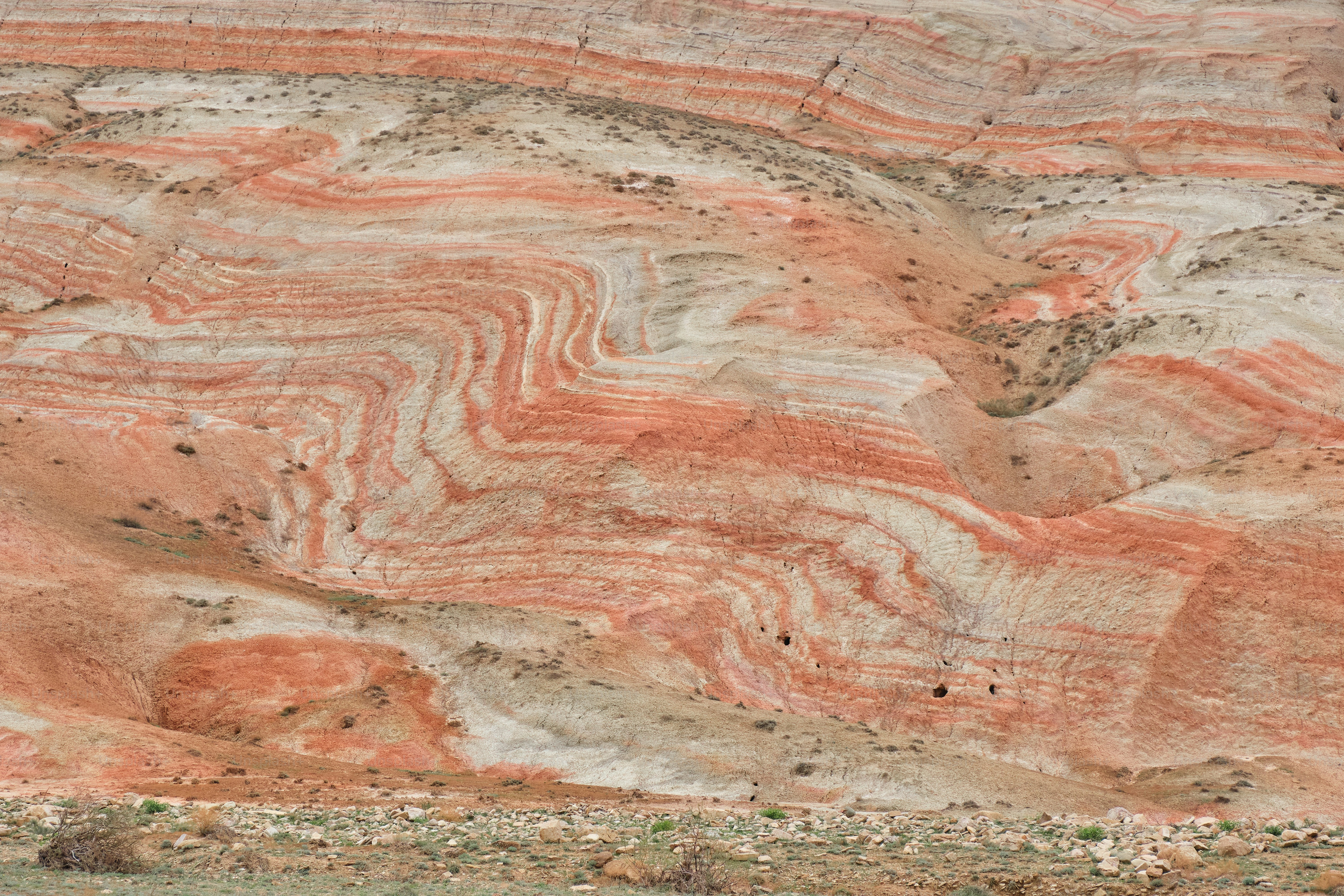 Stratified rocks display beautiful red and white layers. photo ...