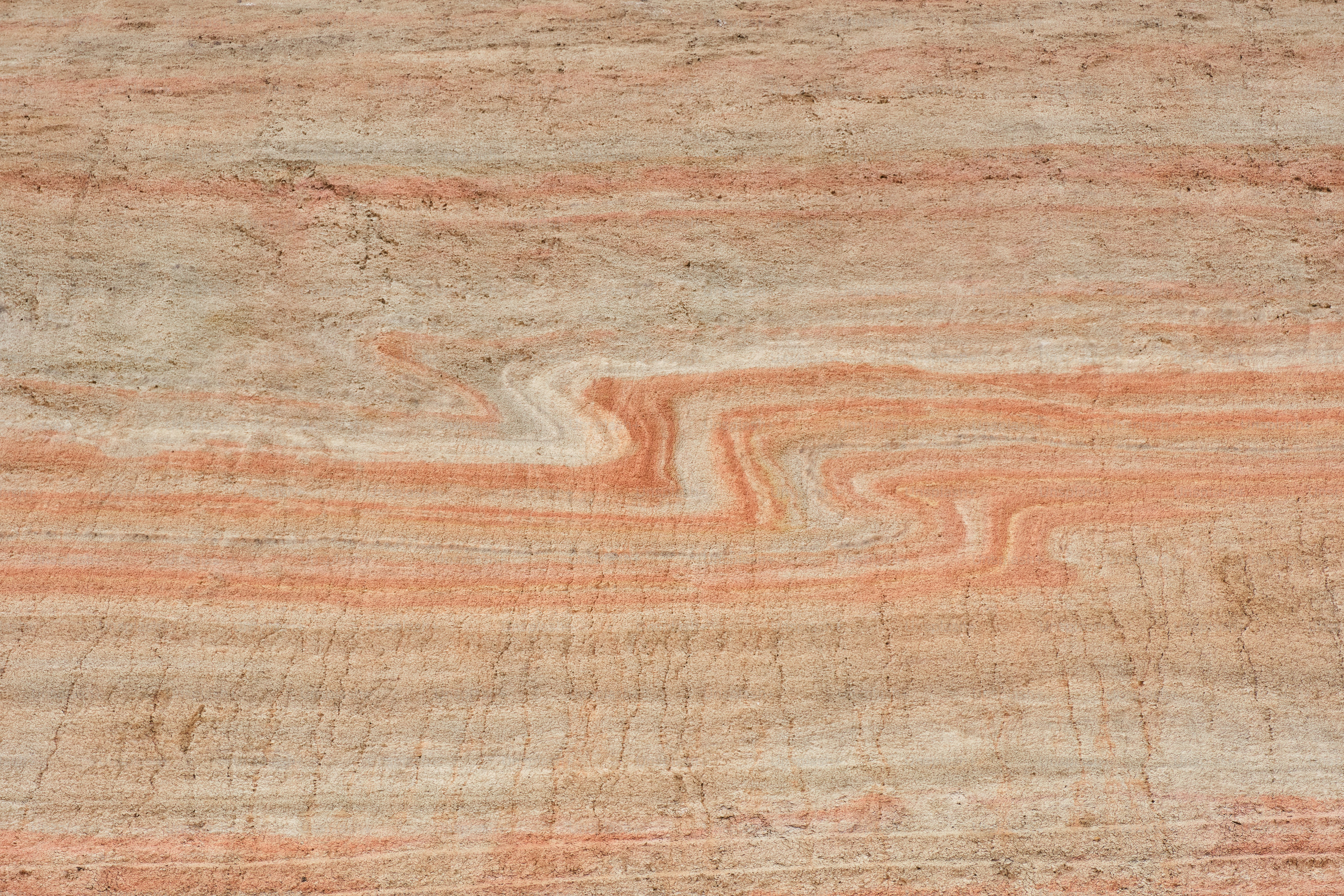 Red and beige bands create a textured rock formation. photo – Minimal ...