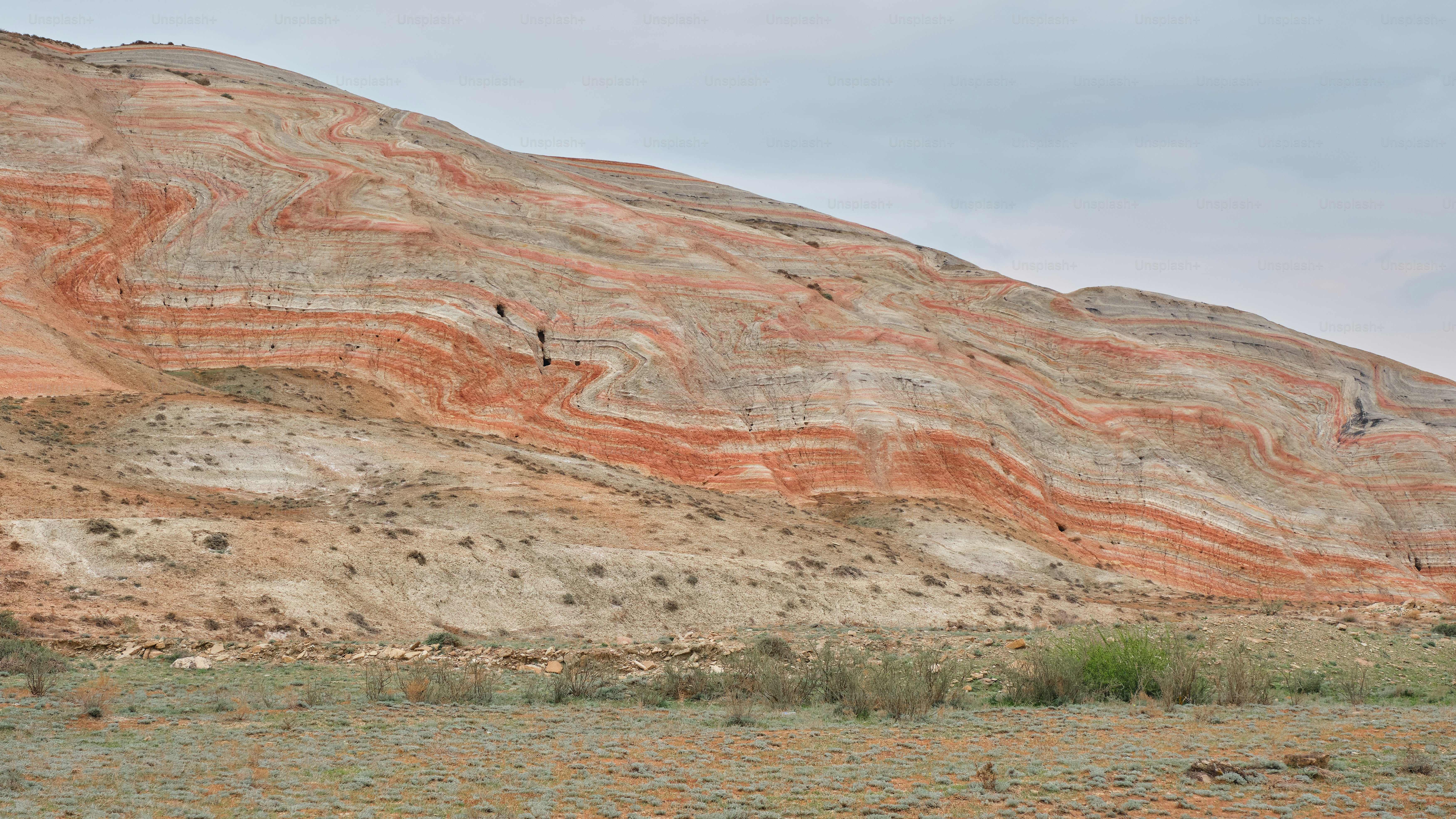 Layered geological formation shows stunning rock layers. photo ...