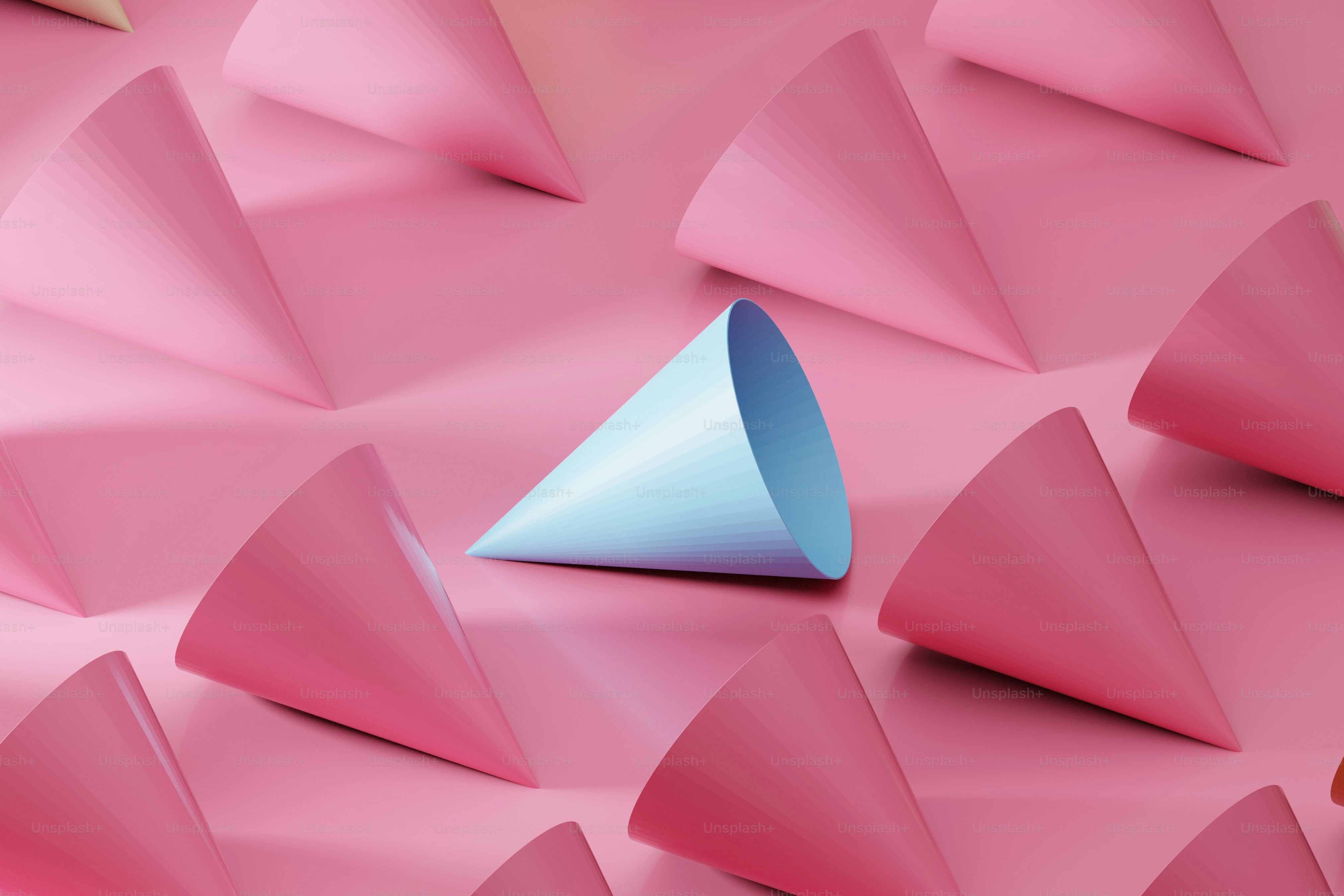 A blue cone stands out among pink ones. photo – 3d render Image on Unsplash