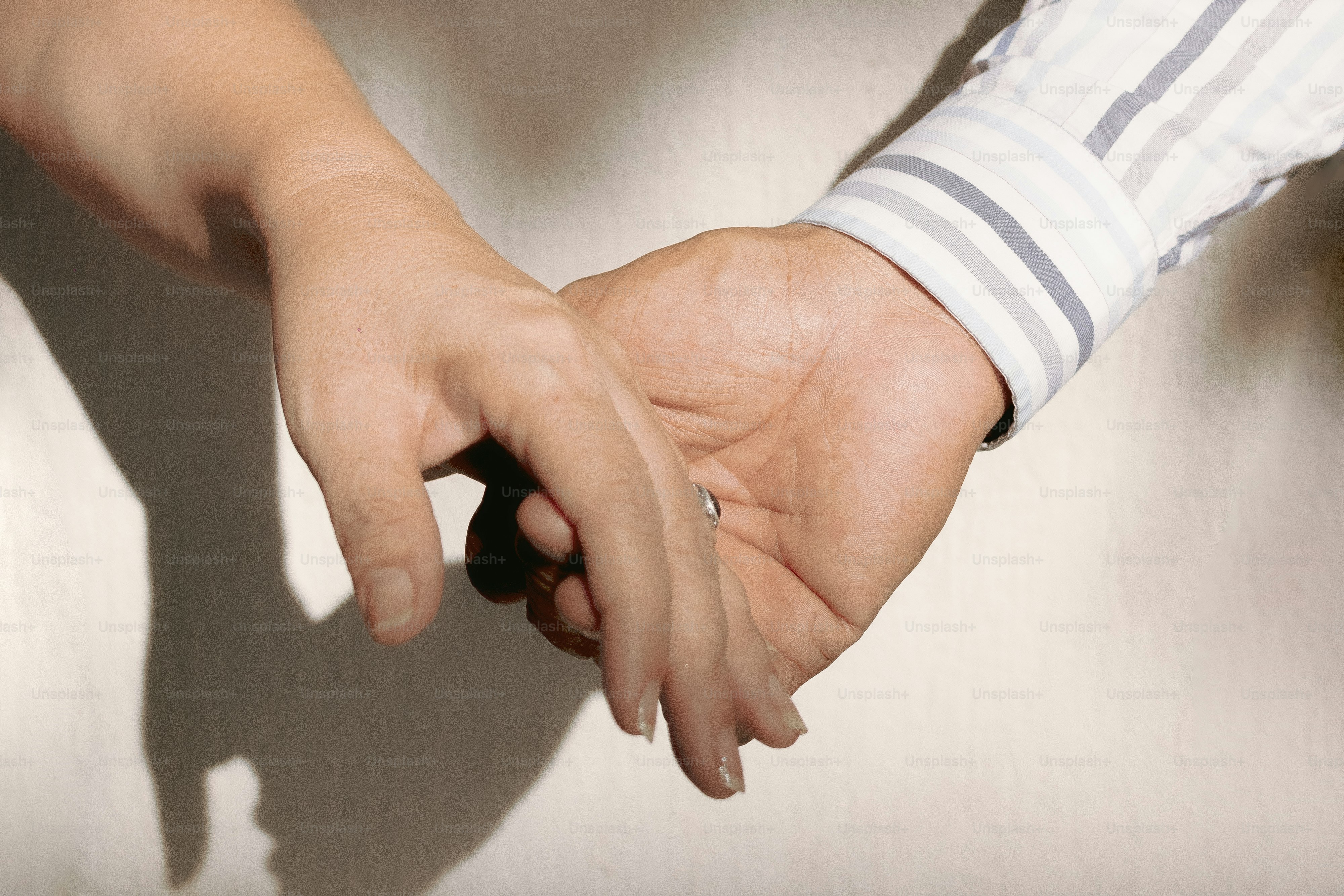Two hands hold each other in a loving embrace. photo – Hands Image on ...