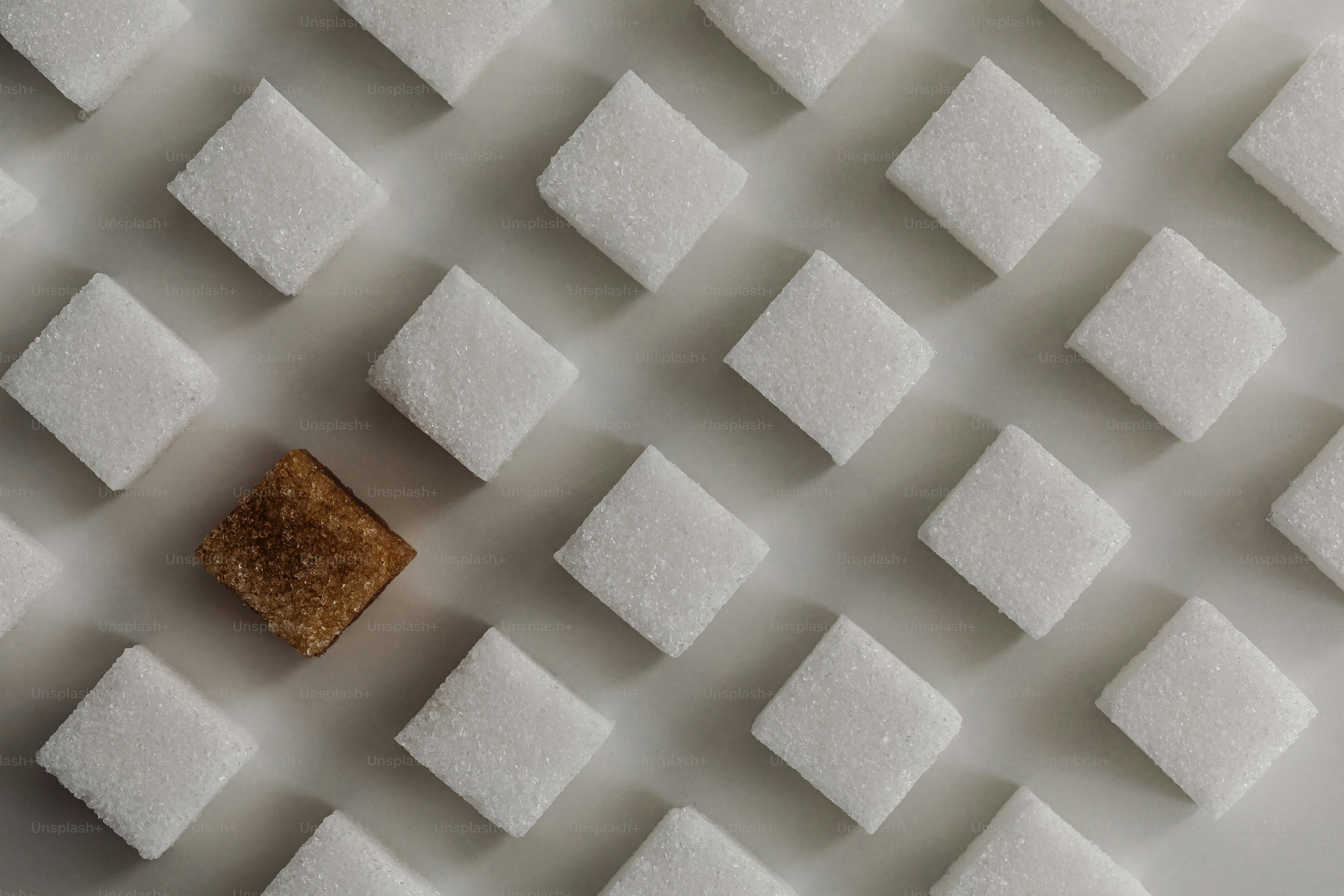 Brown sugar cube stands out from white ones. photo – Unique Image on ...