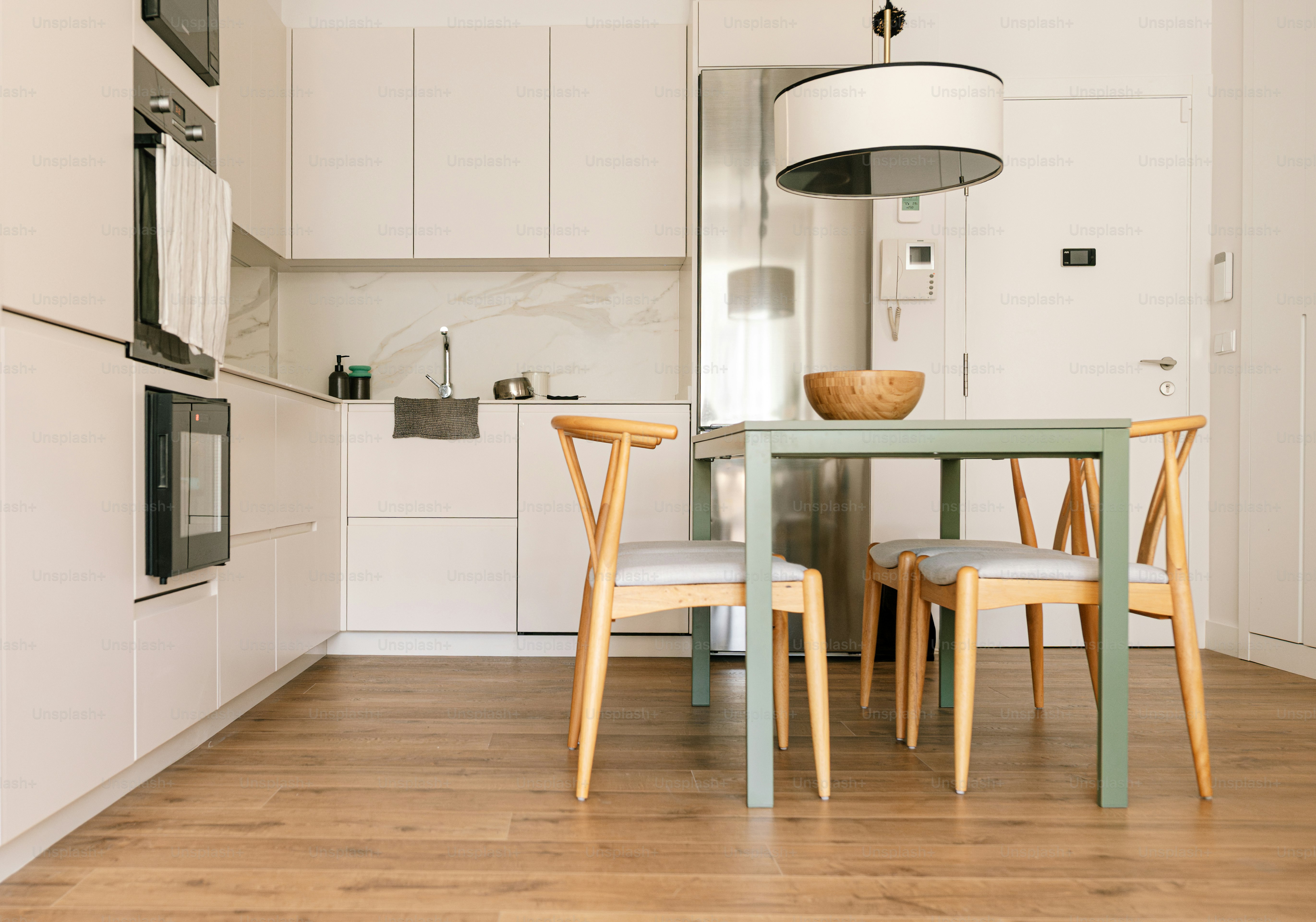 Modern kitchen features a table and wooden bowl. photo – Interior ...