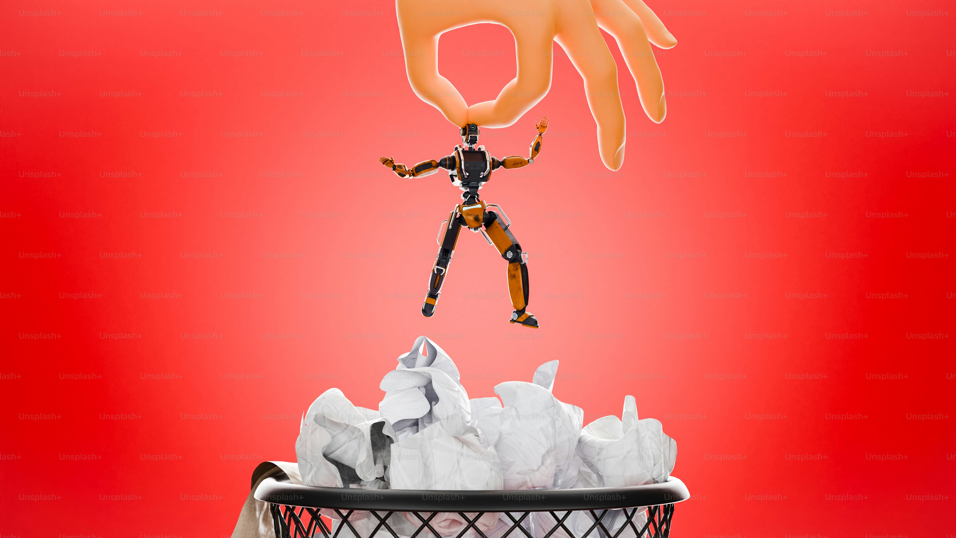 A hand is throwing a robot into a trashcan. photo – Technology Image on ...