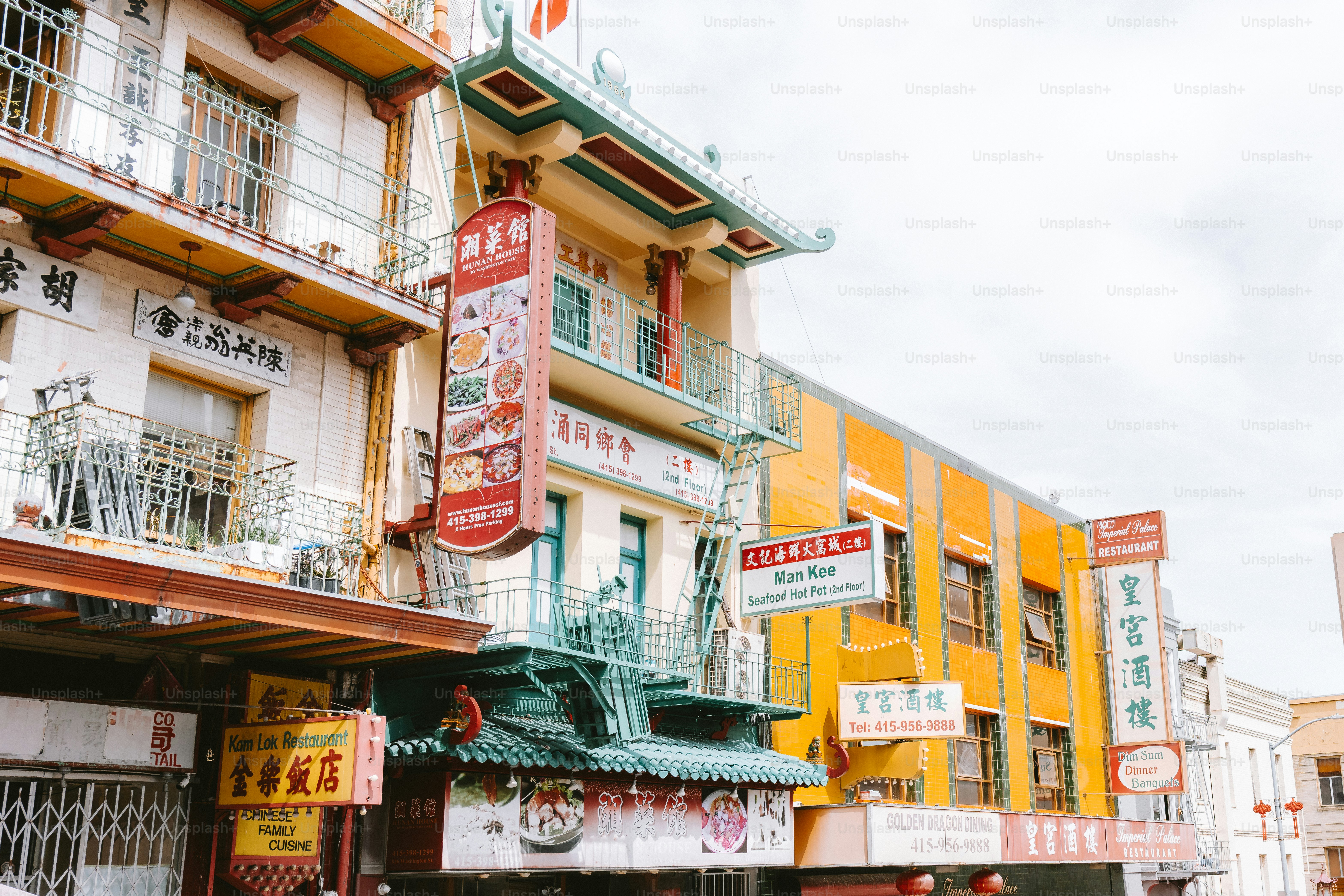 Chinatown buildings with ornate architecture are visible. photo ...