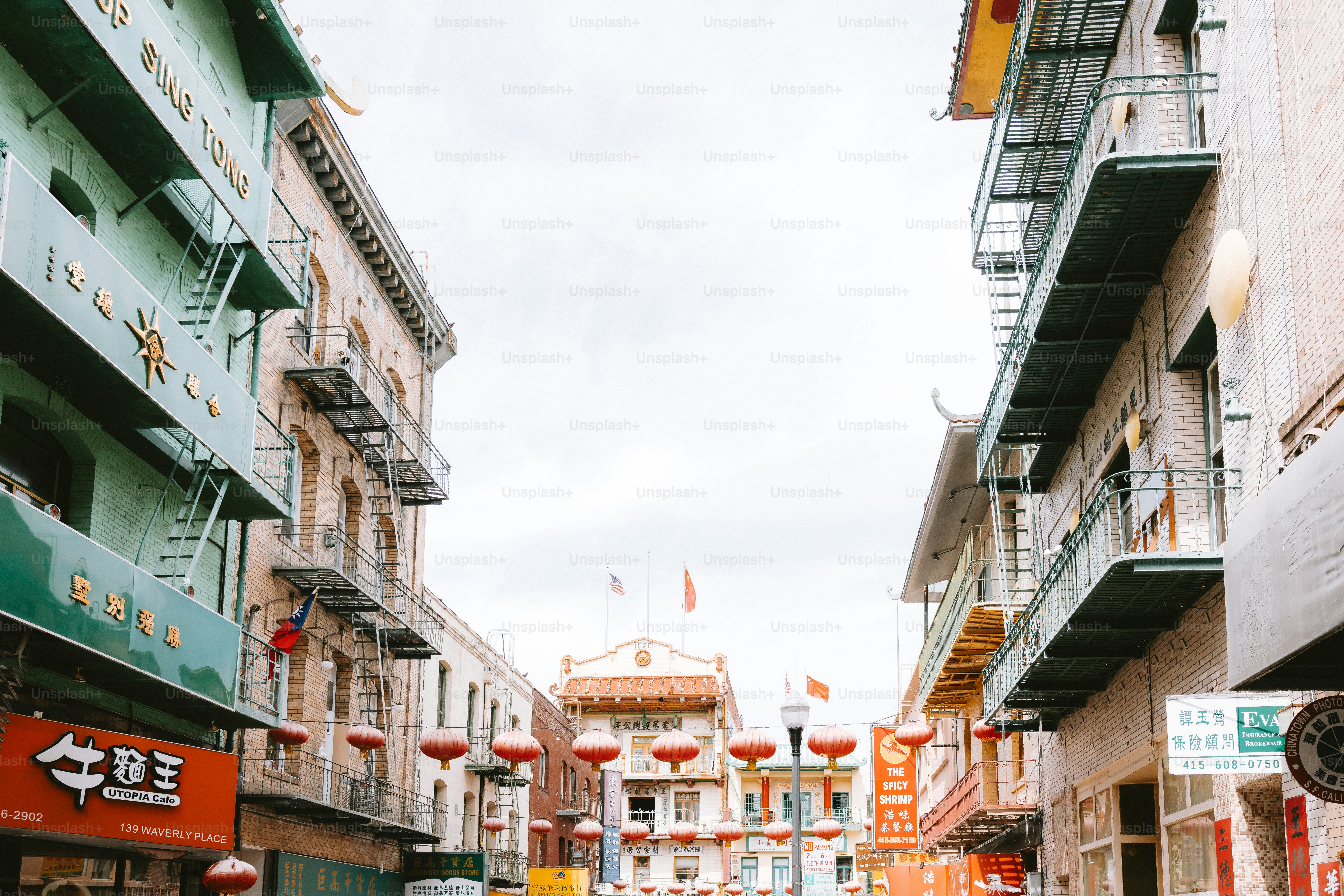 Chinatown buildings with ornate architecture are visible. photo ...