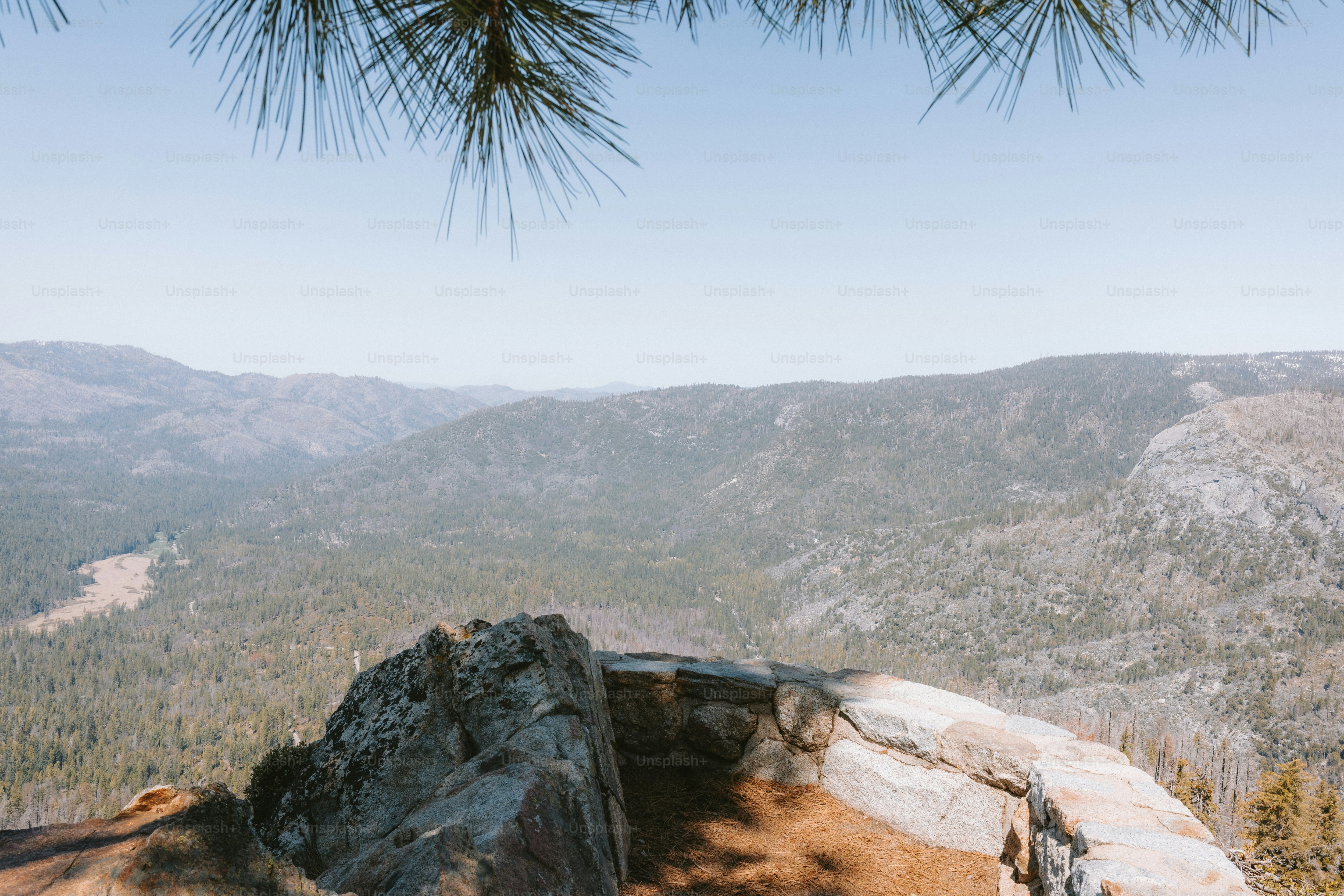 Mountains and landscape are seen from an elevated viewpoint. photo ...