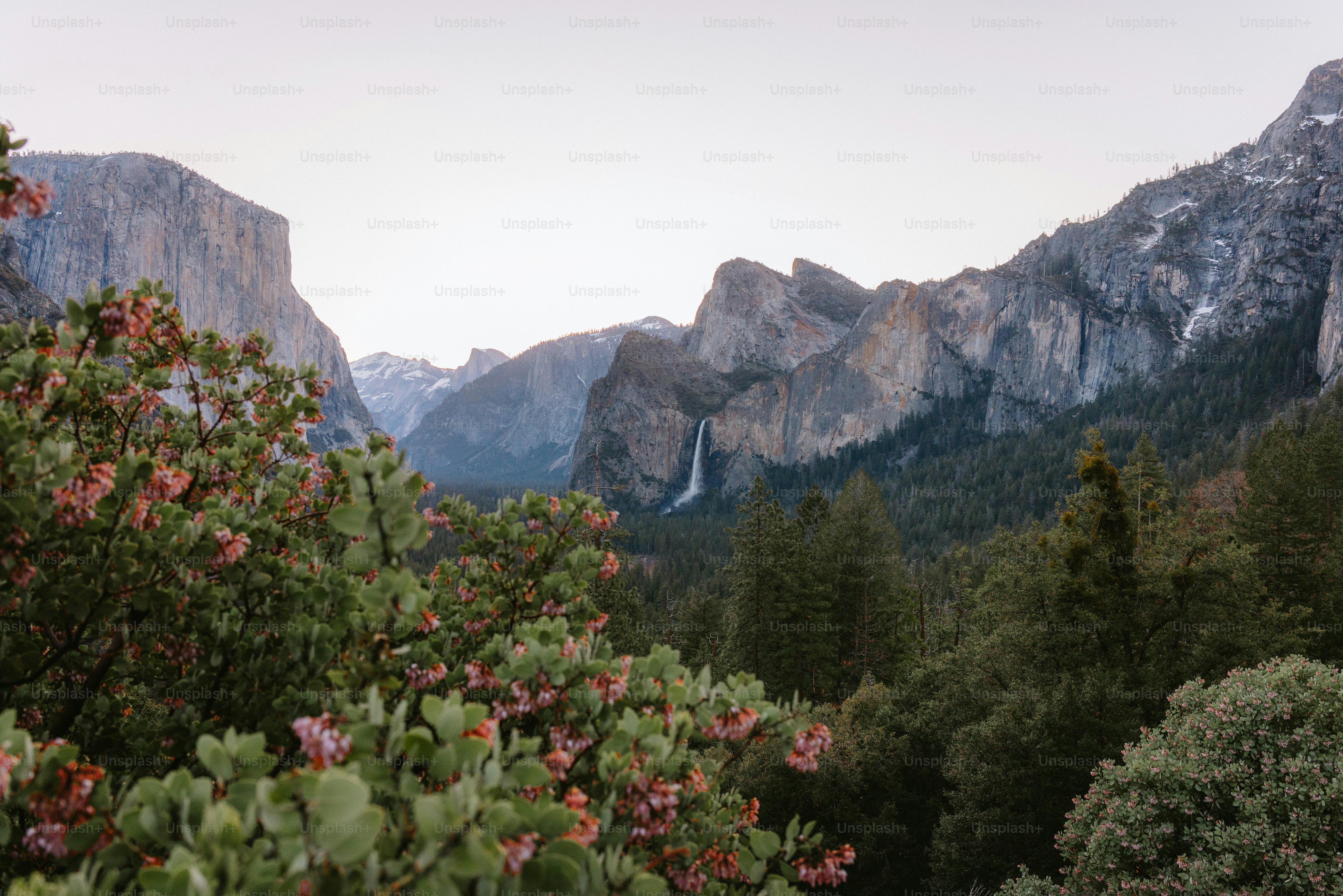A valley landscape shows mountains and a waterfall. photo – Waterfall ...