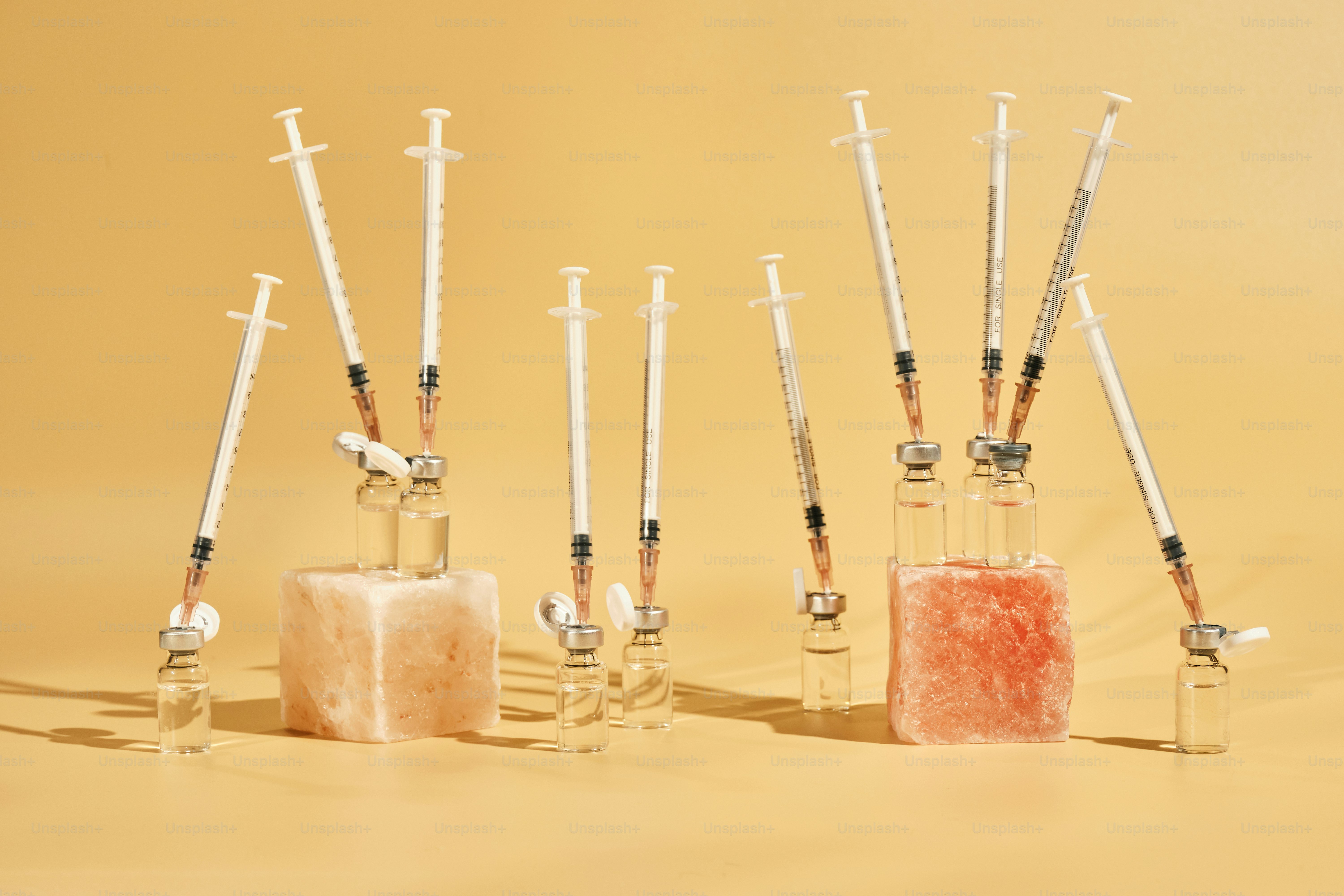 Syringes inject into vials, preparing for injection. photo – Health ...