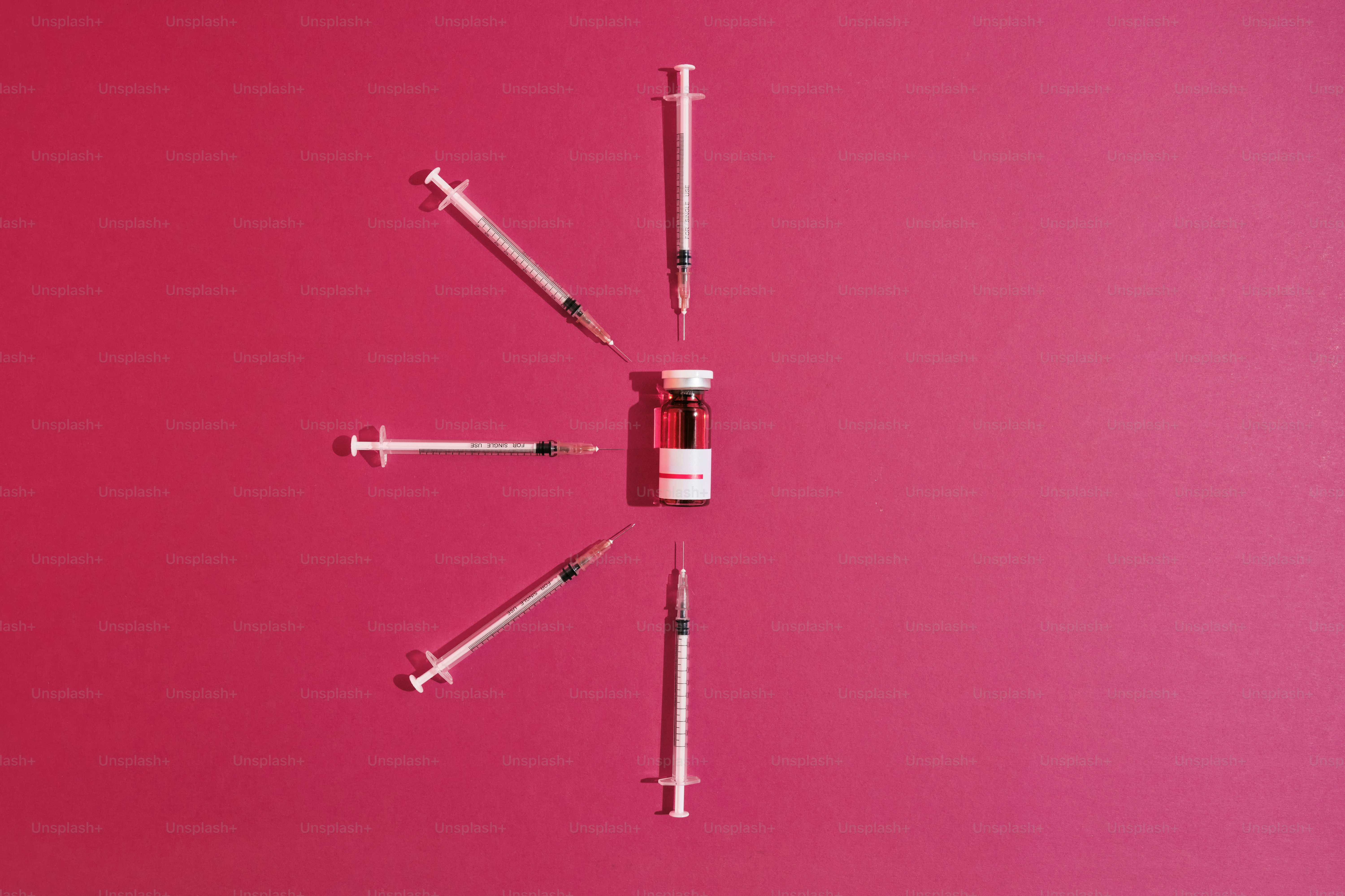 Vaccine vial surrounded by syringes, ready for injection. photo ...