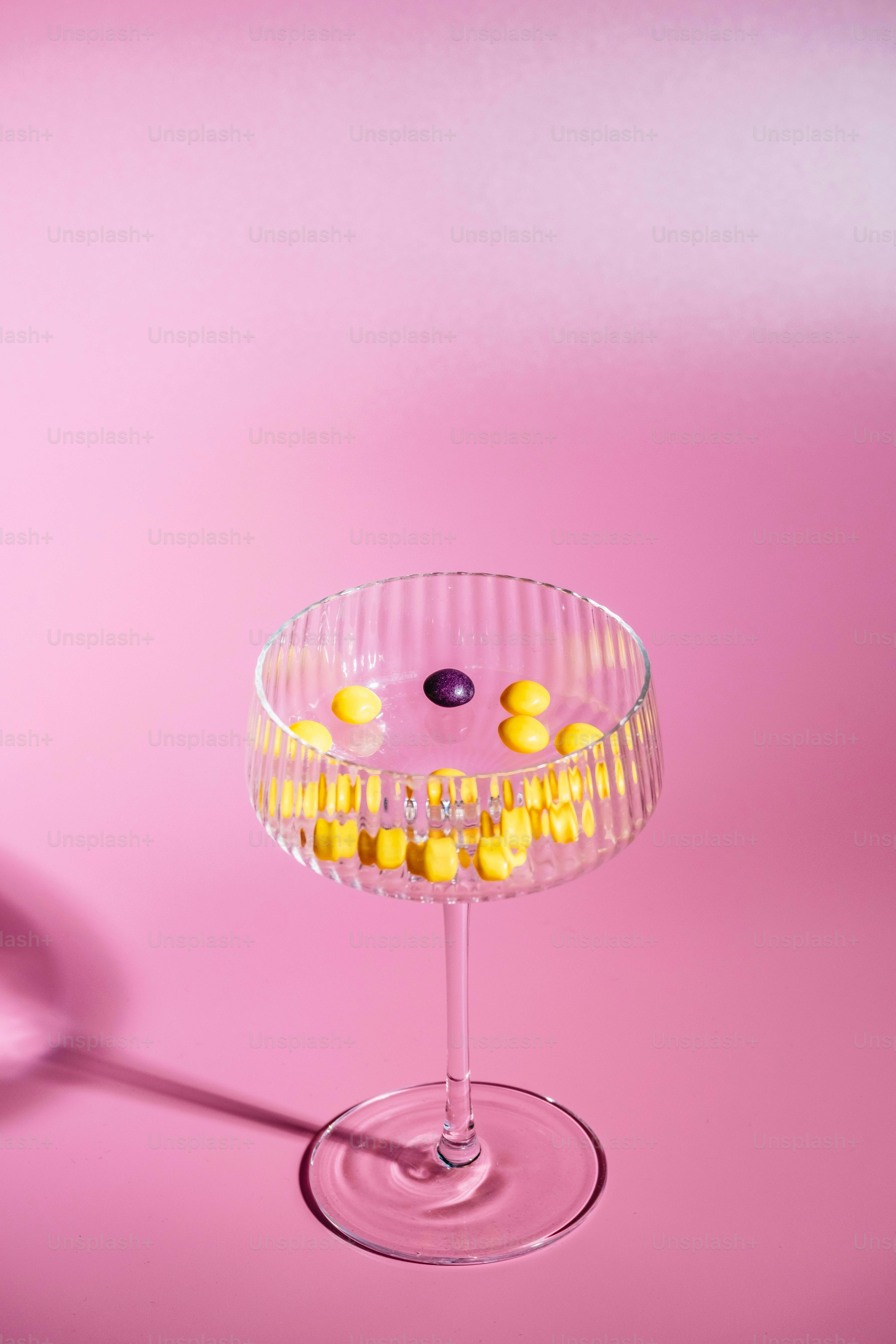 Candy and pill in a cocktail glass. photo – Food Image on Unsplash