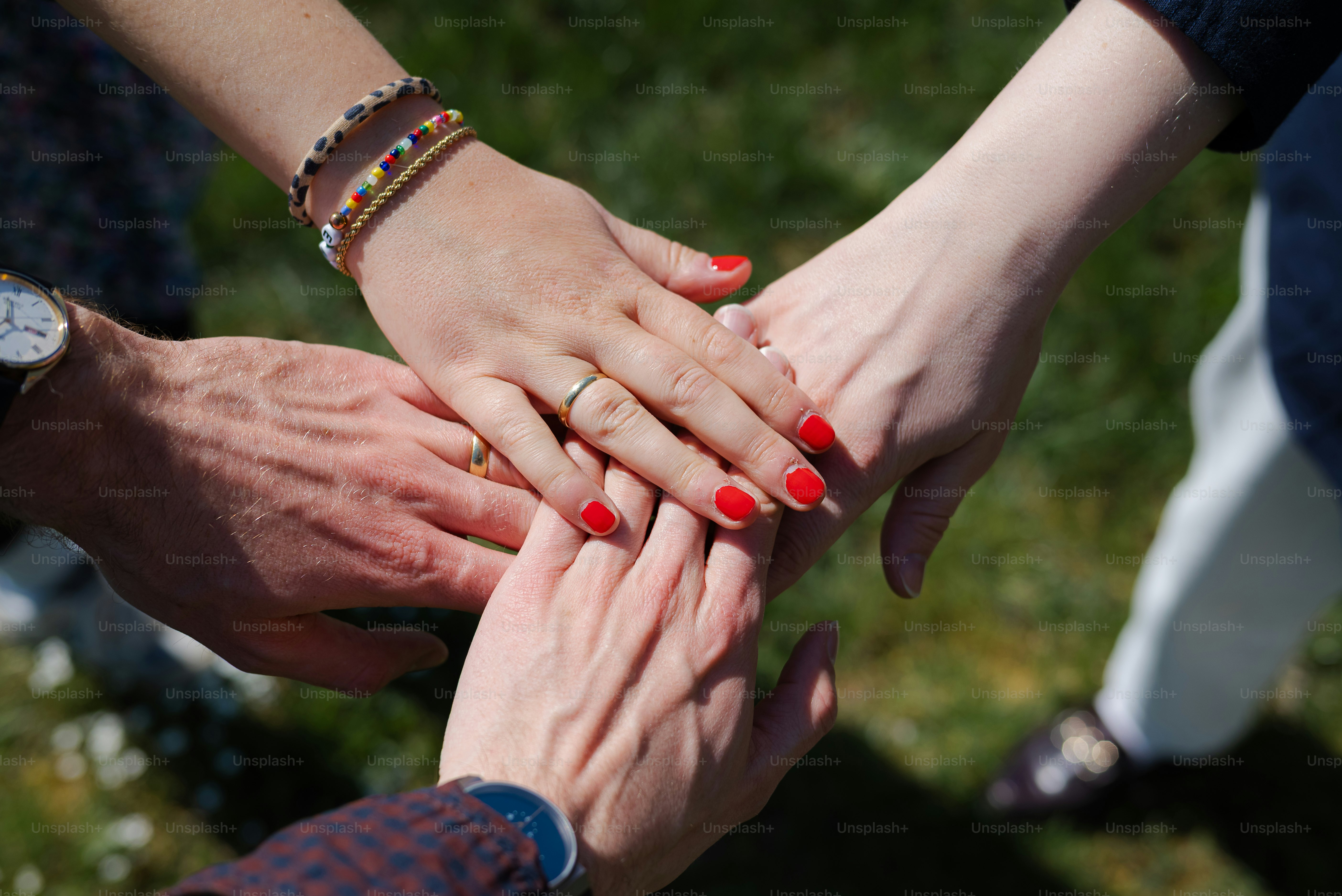 People put their hands together in unity. photo – Team Image on Unsplash