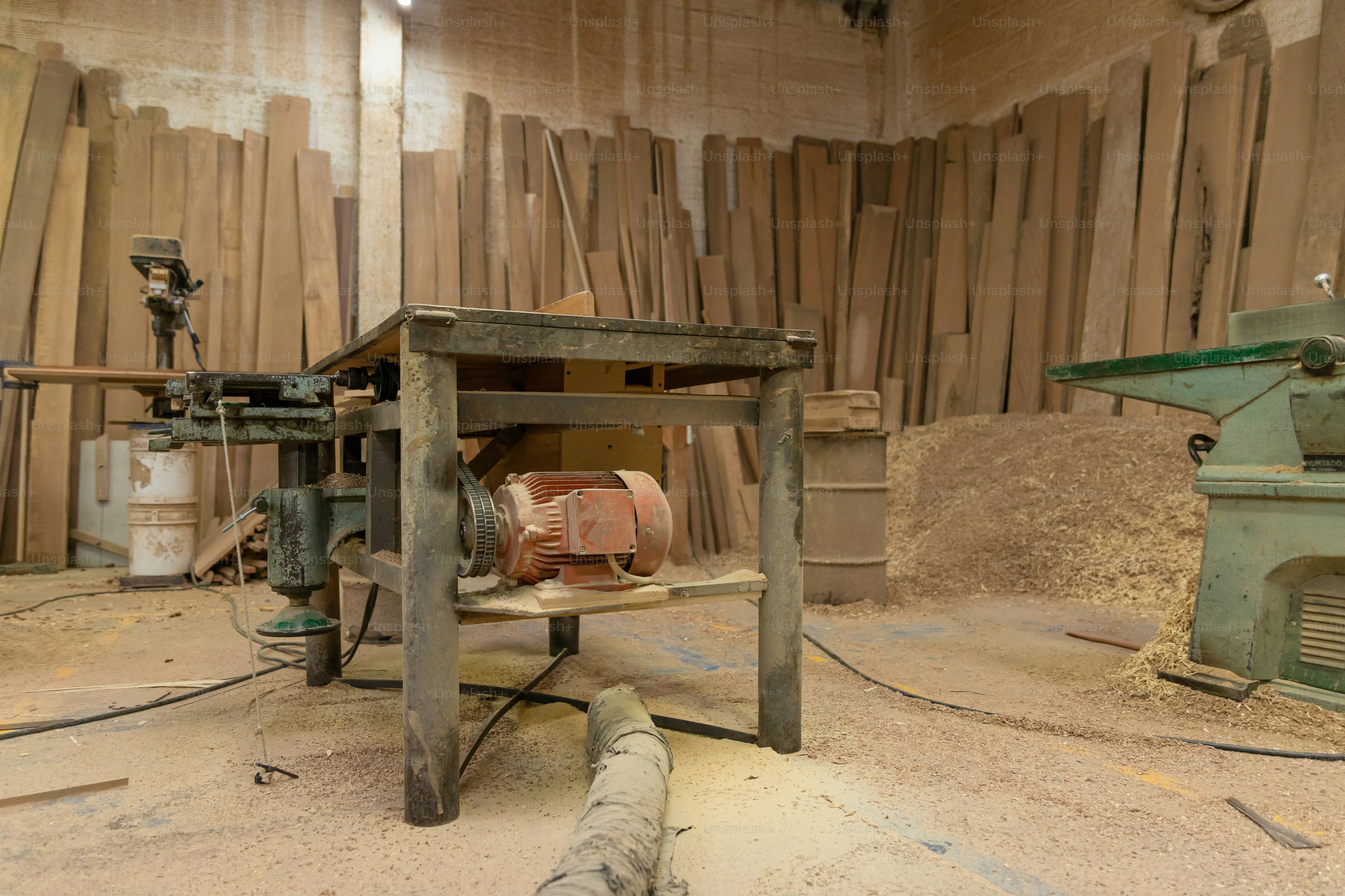 A woodworking shop is filled with lumber and tools. photo – Luxury ...