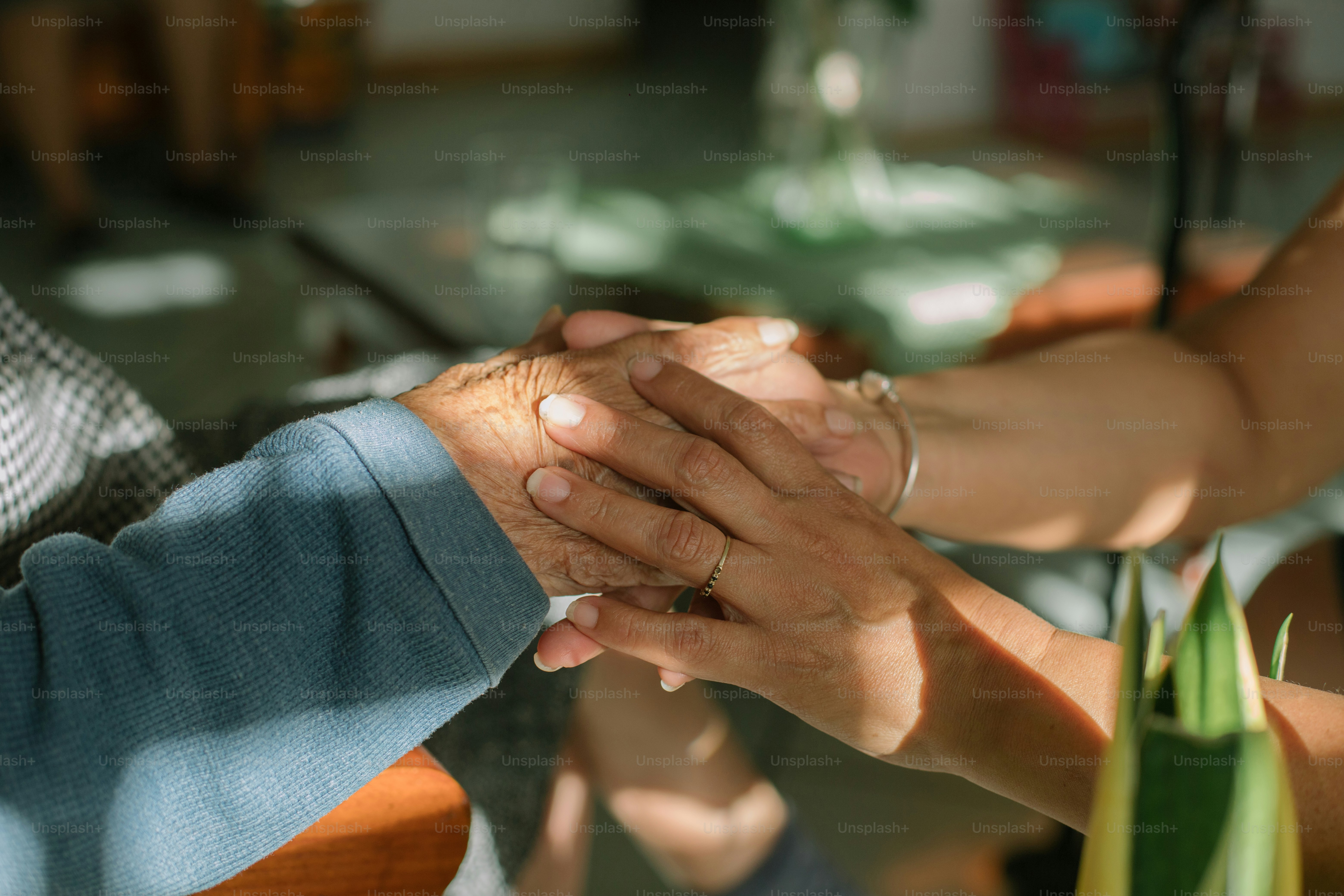 People hold hands together in a gesture of support. photo – Hands Image ...