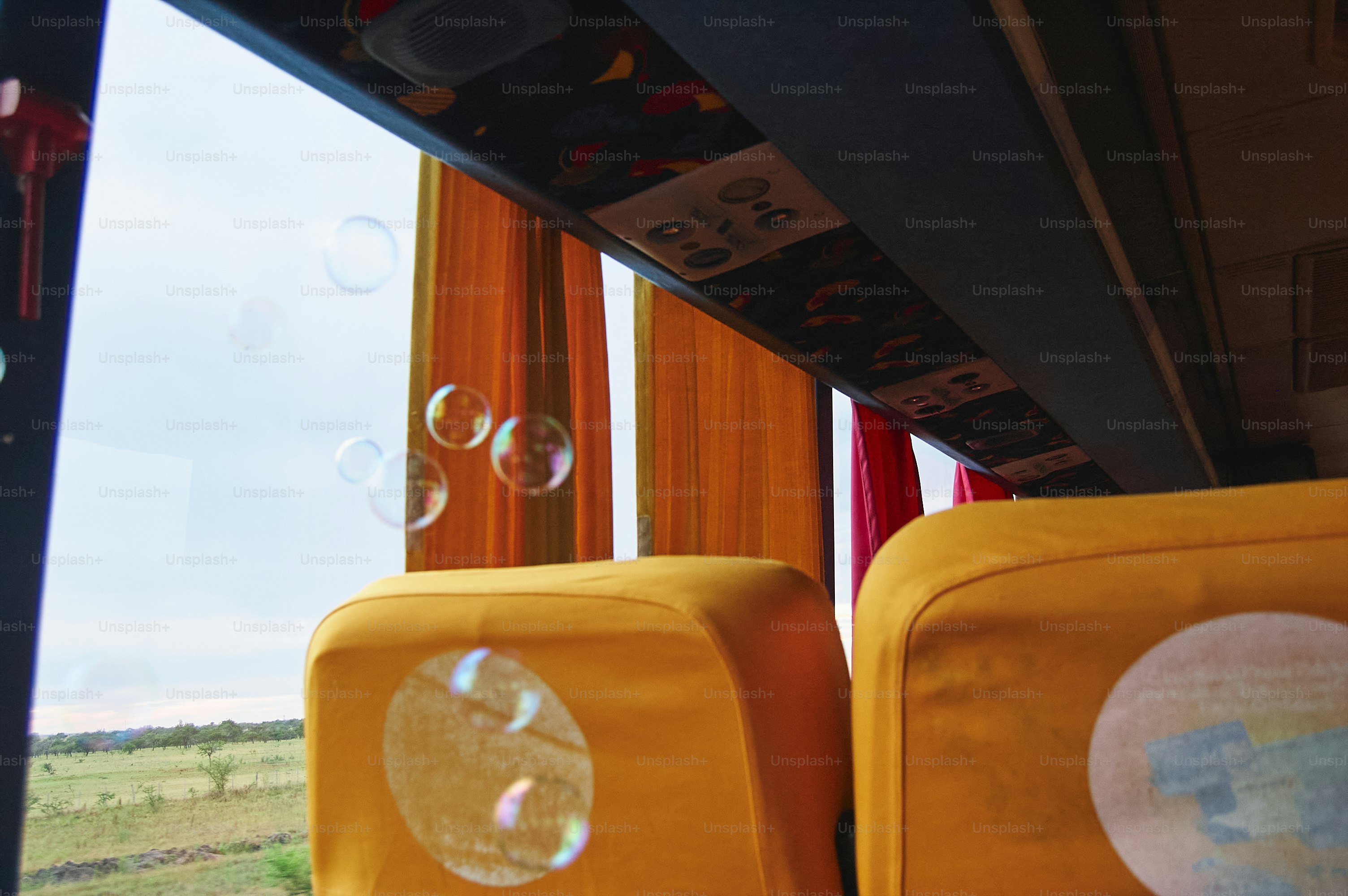 Bubbles float inside a bus near the window. photo – Travel Image on ...