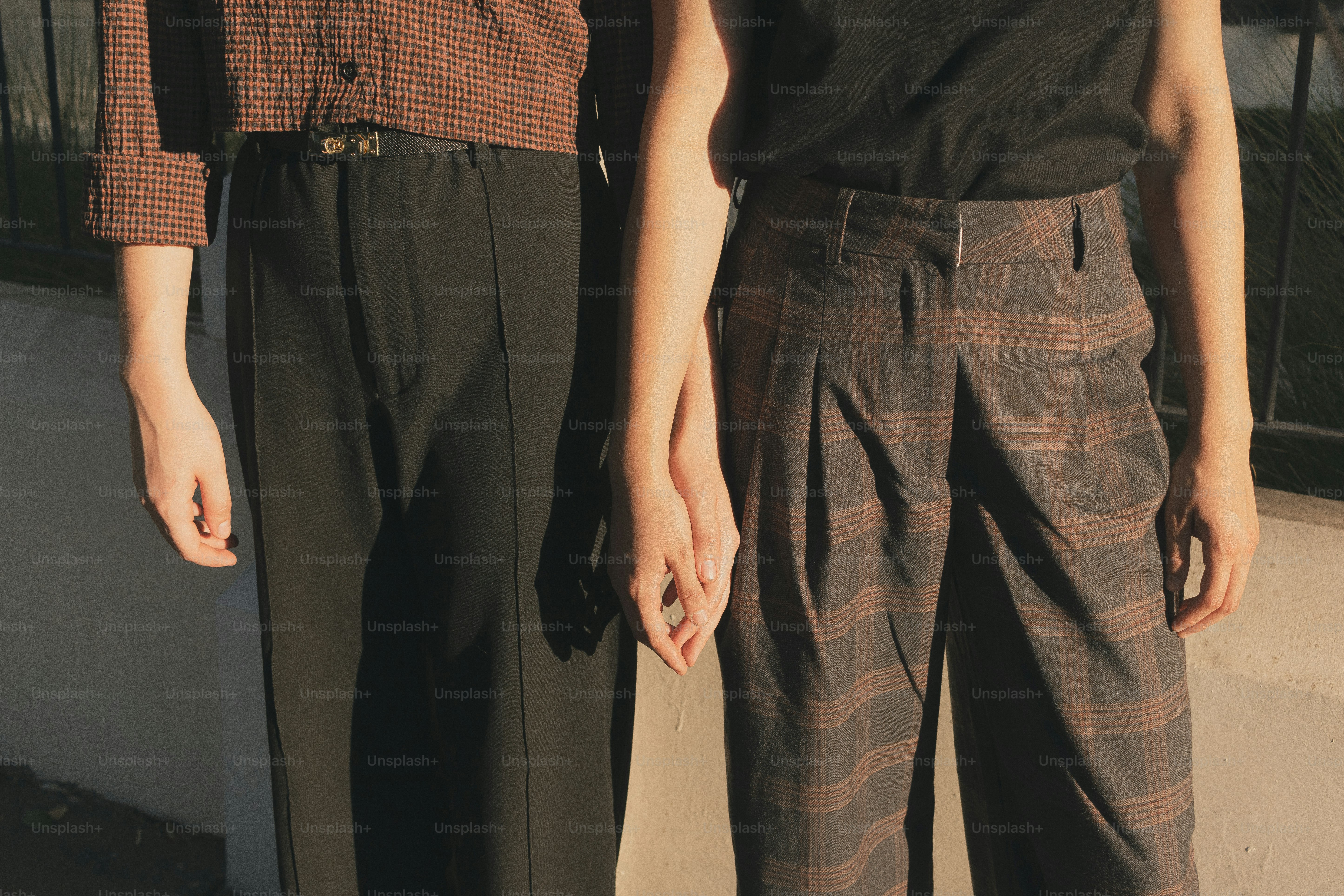 Two people hold hands, standing together. photo – Portrait Image on ...