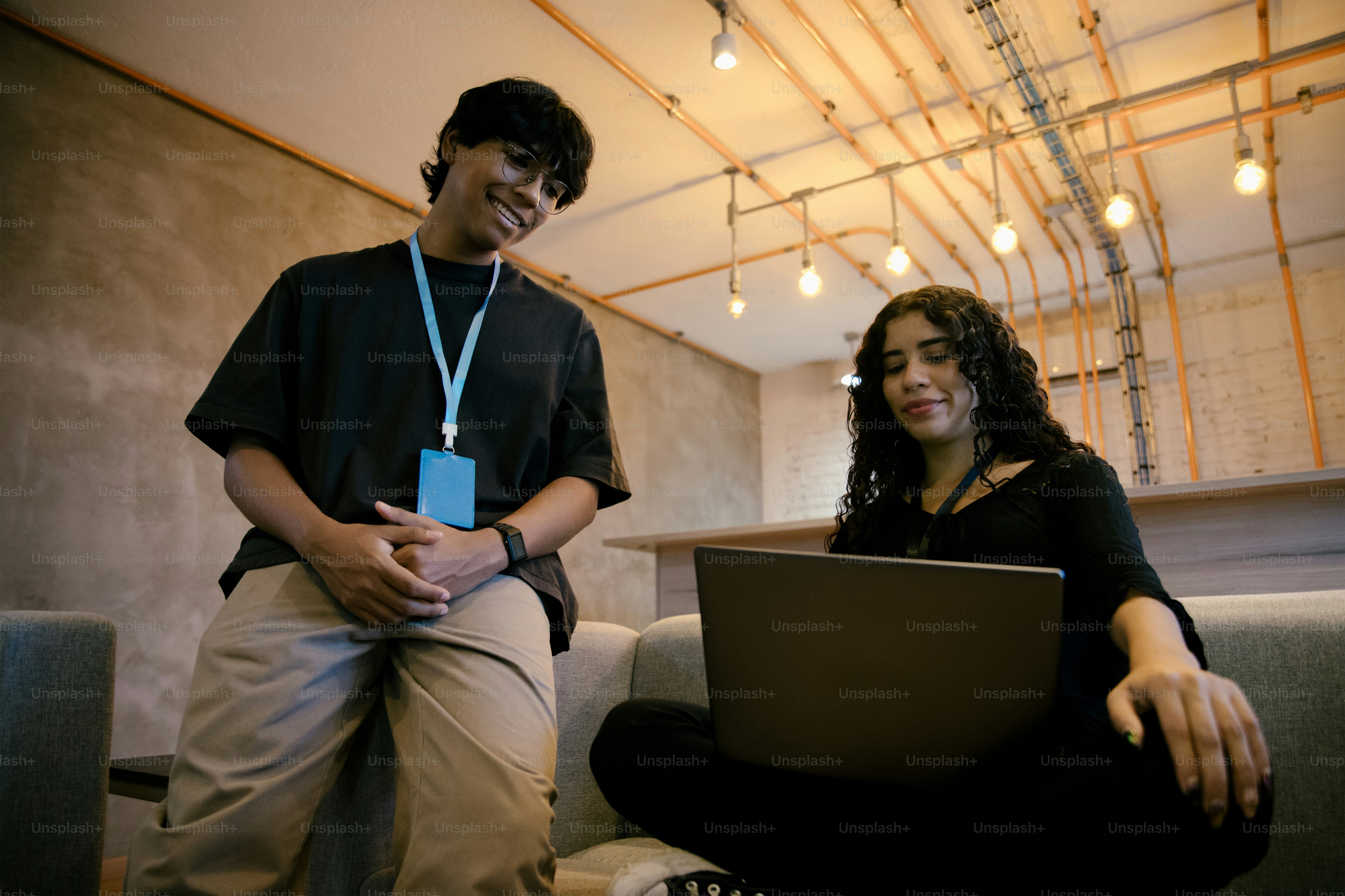 Two people work together in an office. photo – Team Image on Unsplash