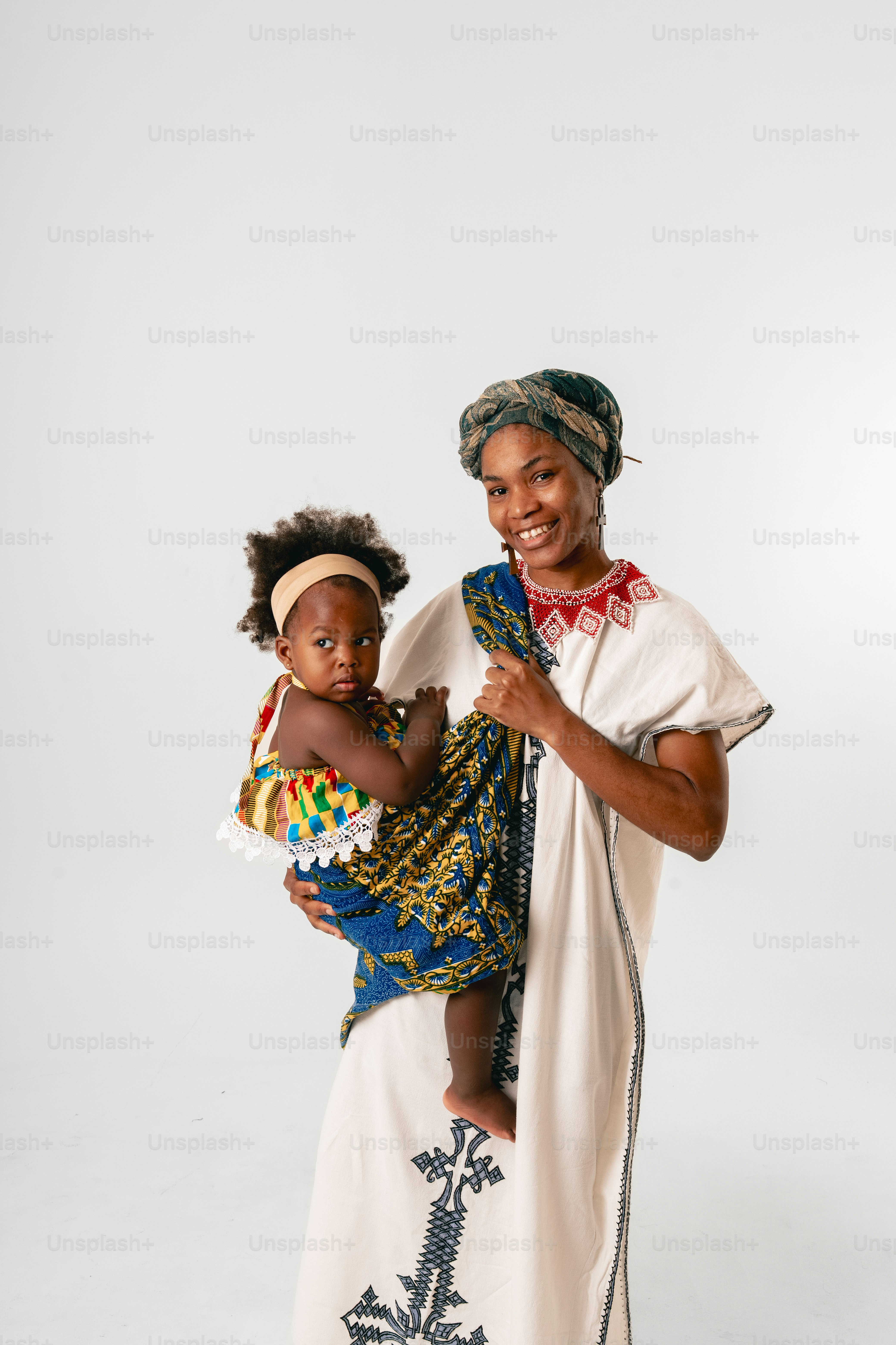 A mother holds her child, both smiling. photo – Happy family Image on ...