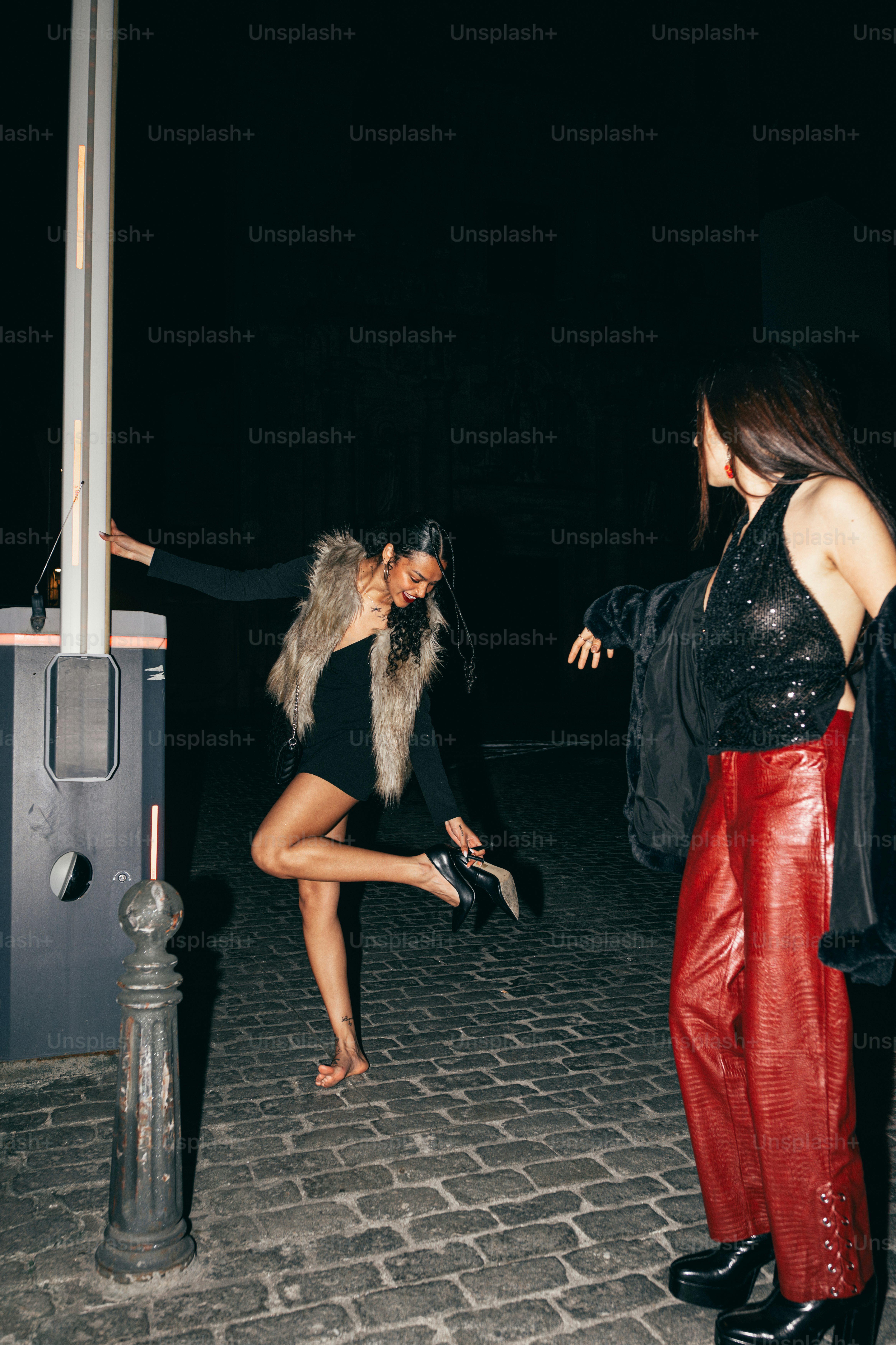 Two women dress up for a night out. photo – Night life Image on Unsplash