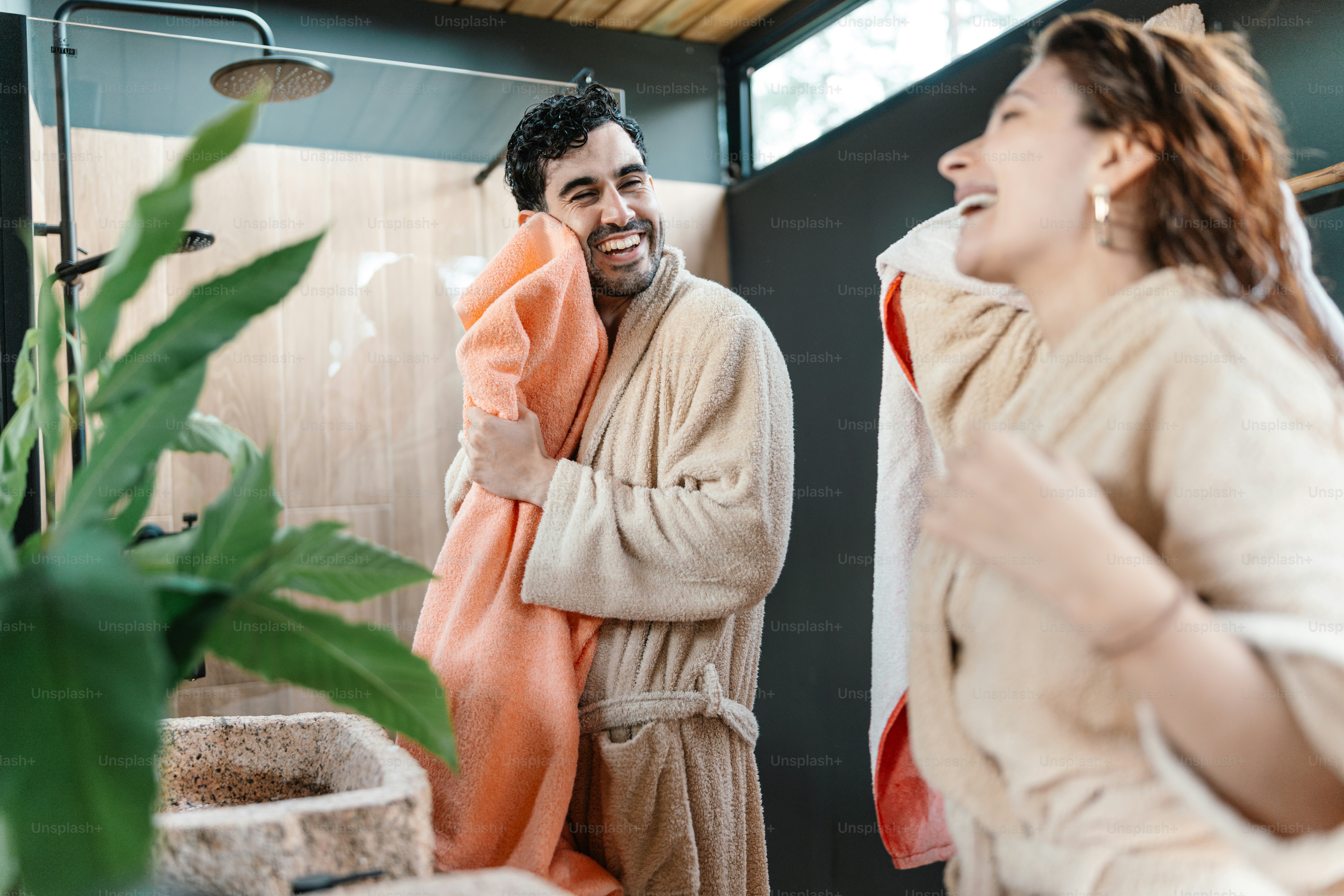 Couple laughing and enjoying the fresh air after a shower. photo ...