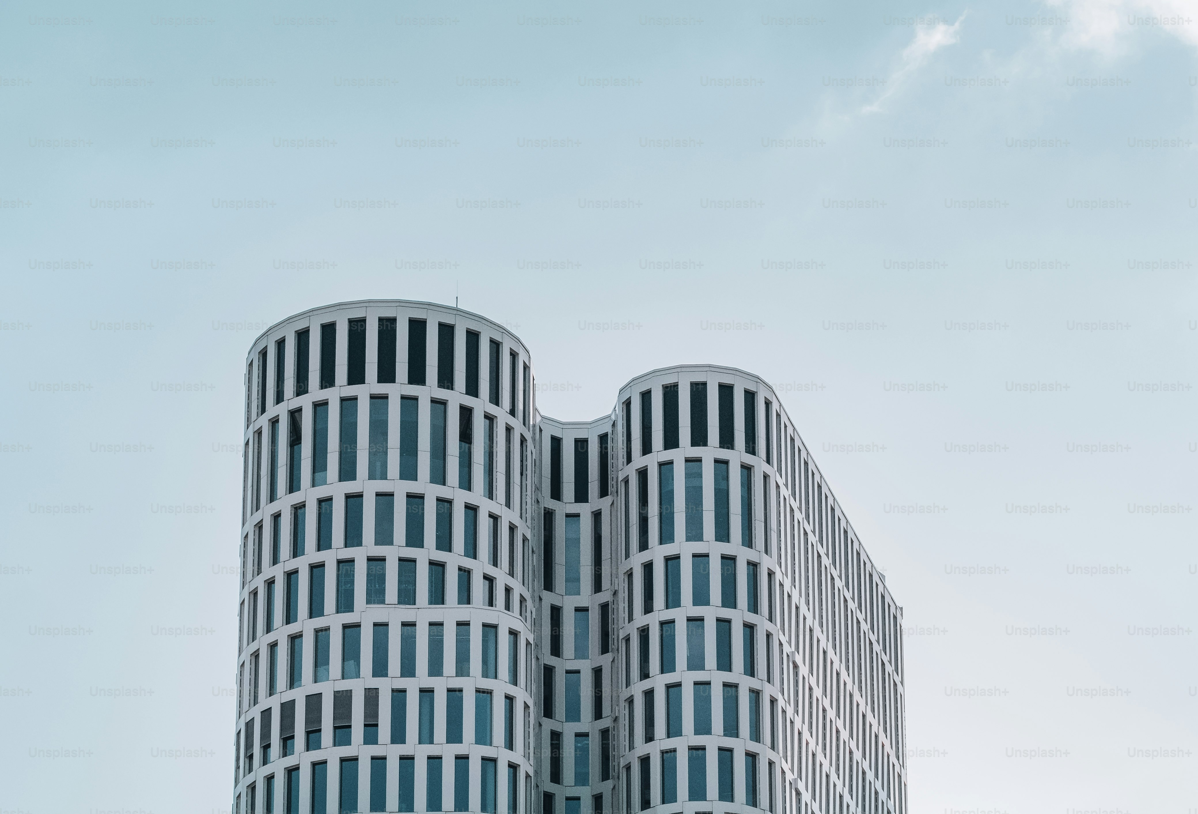 Modern building with a unique, rounded design. photo – Wallpaper Image ...