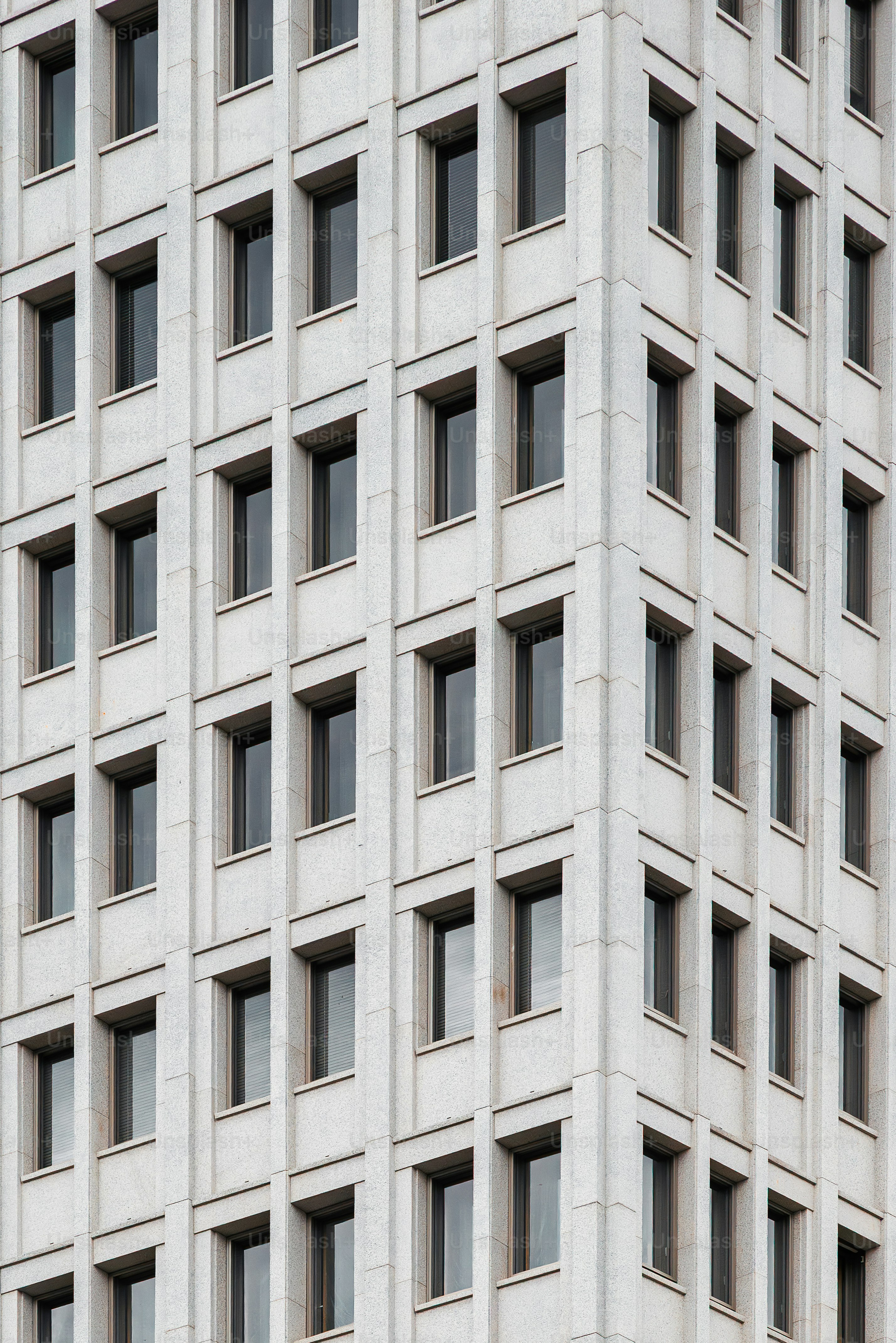 Modern building's corner with repetitive windows. photo – Architecture ...