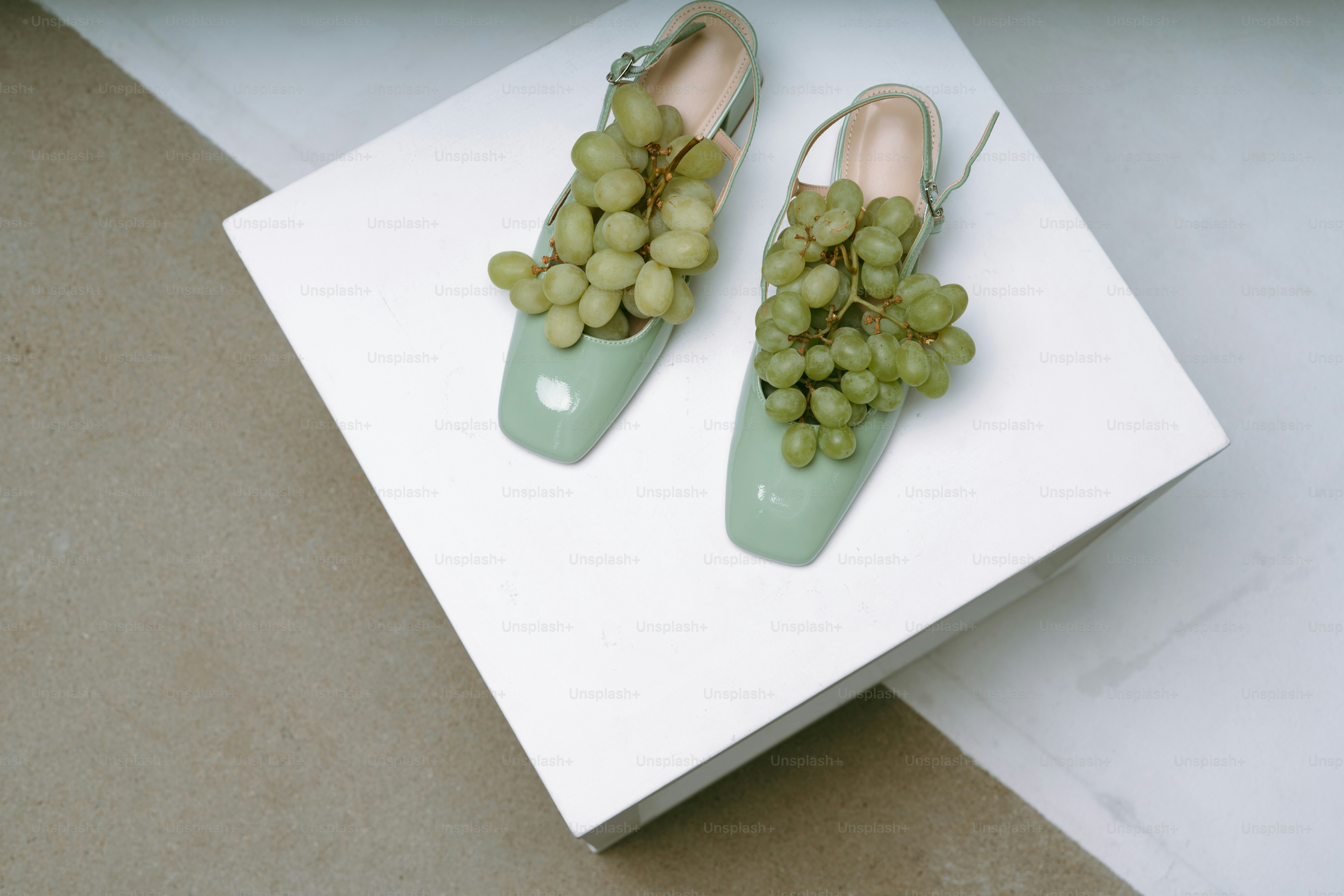 Green shoes are filled with green grapes. photo – Experimental Image on ...