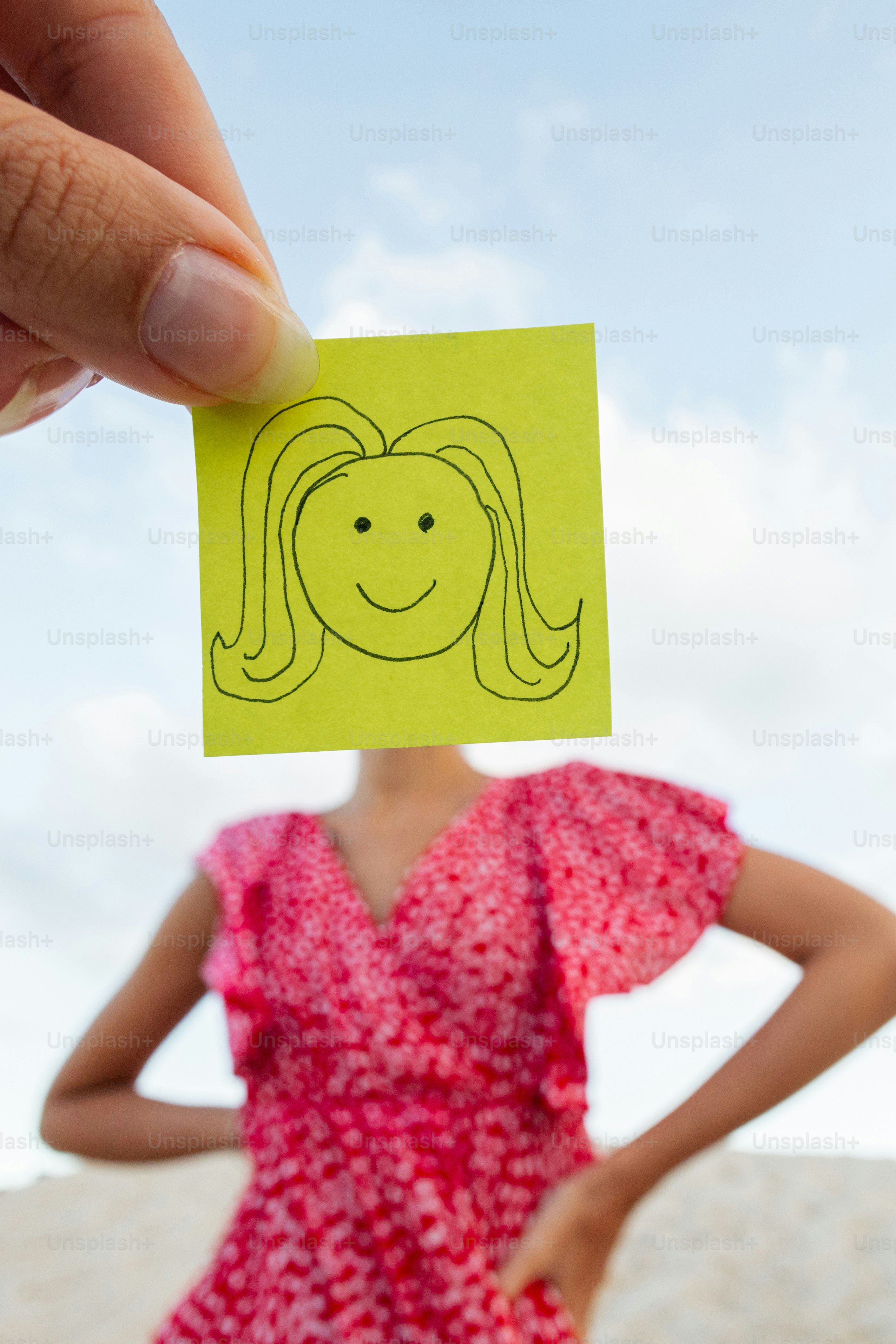 A sticky note face completes a smiling woman. photo – Perspective Image ...