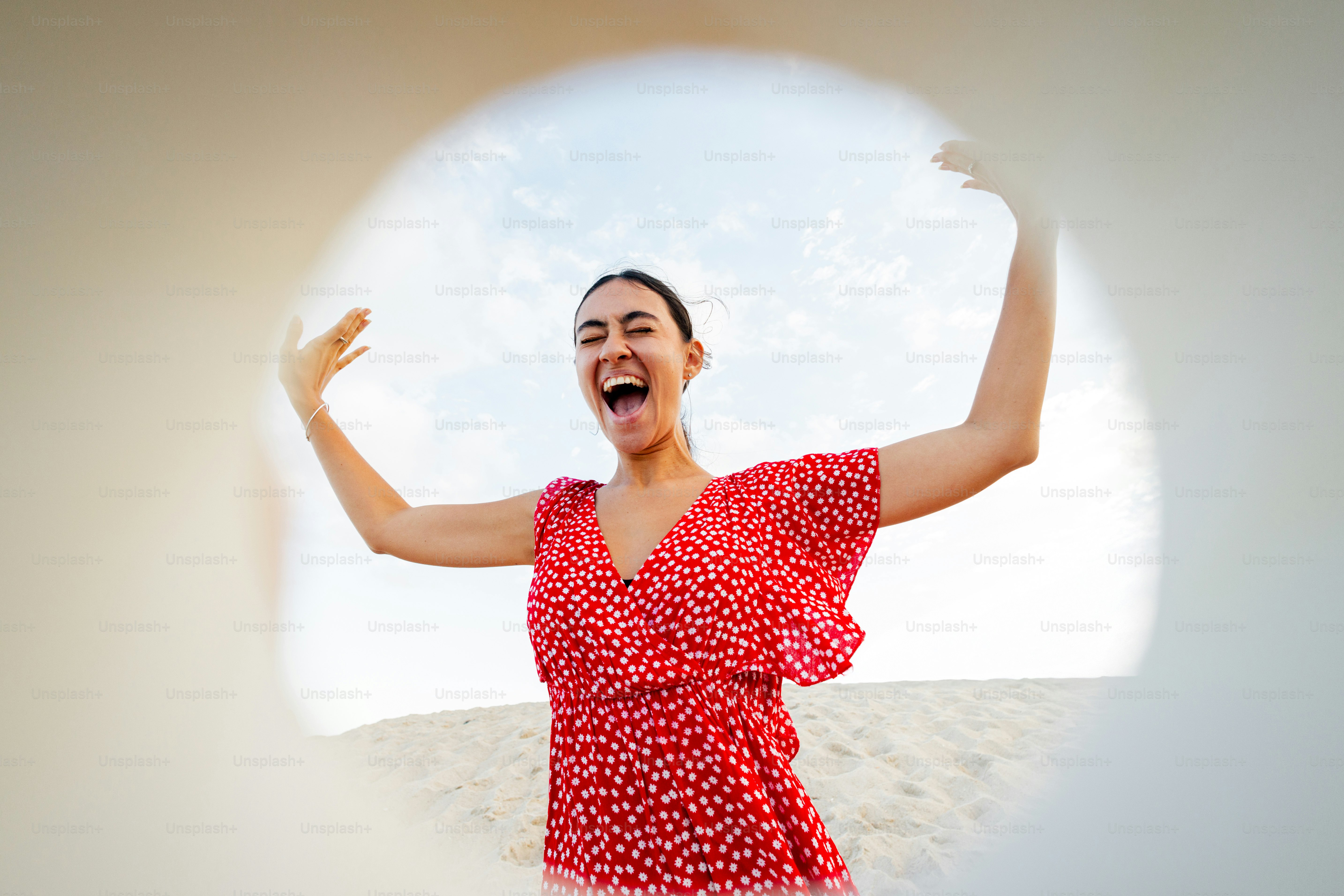 Woman joyfully poses with open arms and happy face. photo – Perspective ...