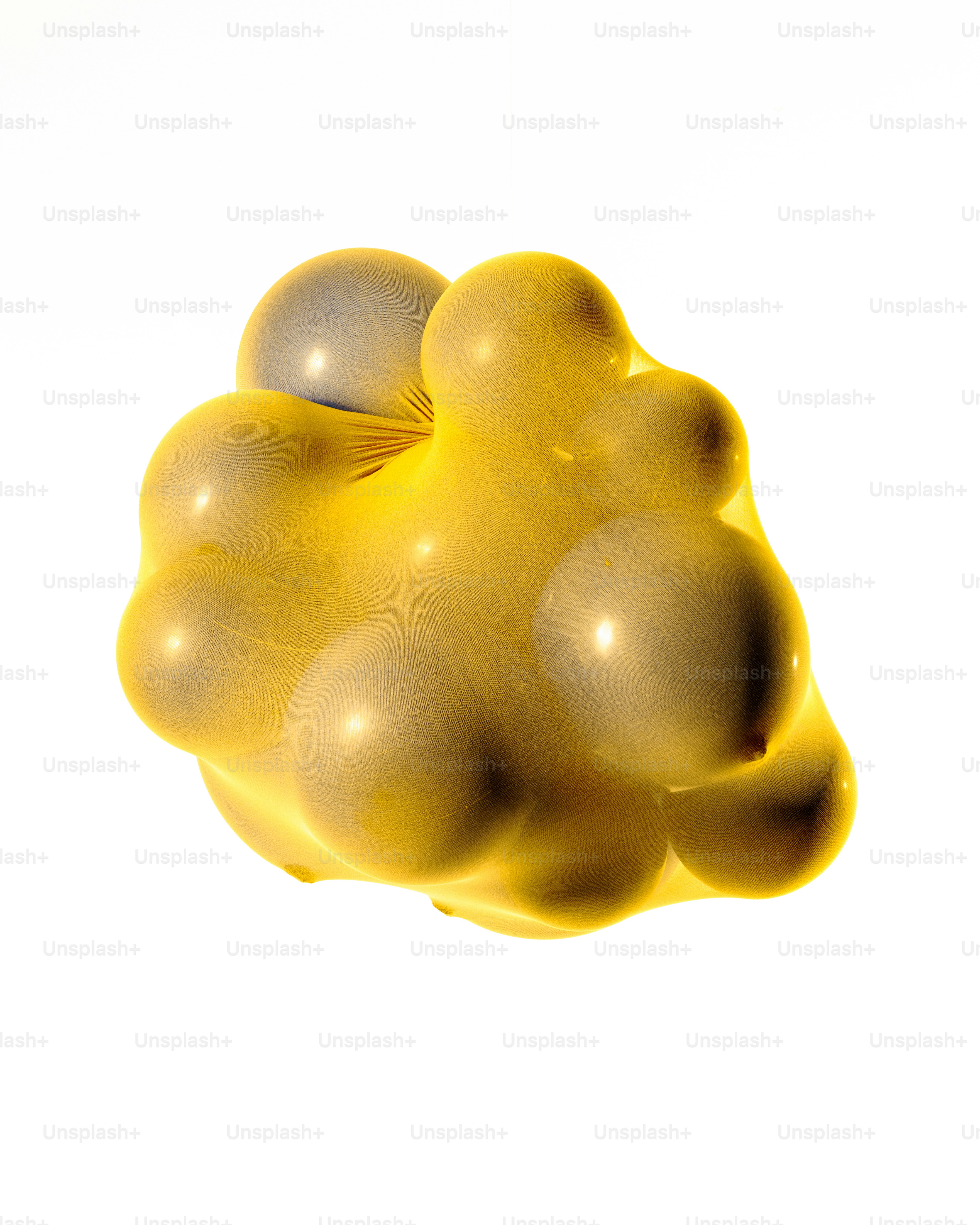 Balloons are enclosed in a yellow net. photo – Abstract Image on Unsplash