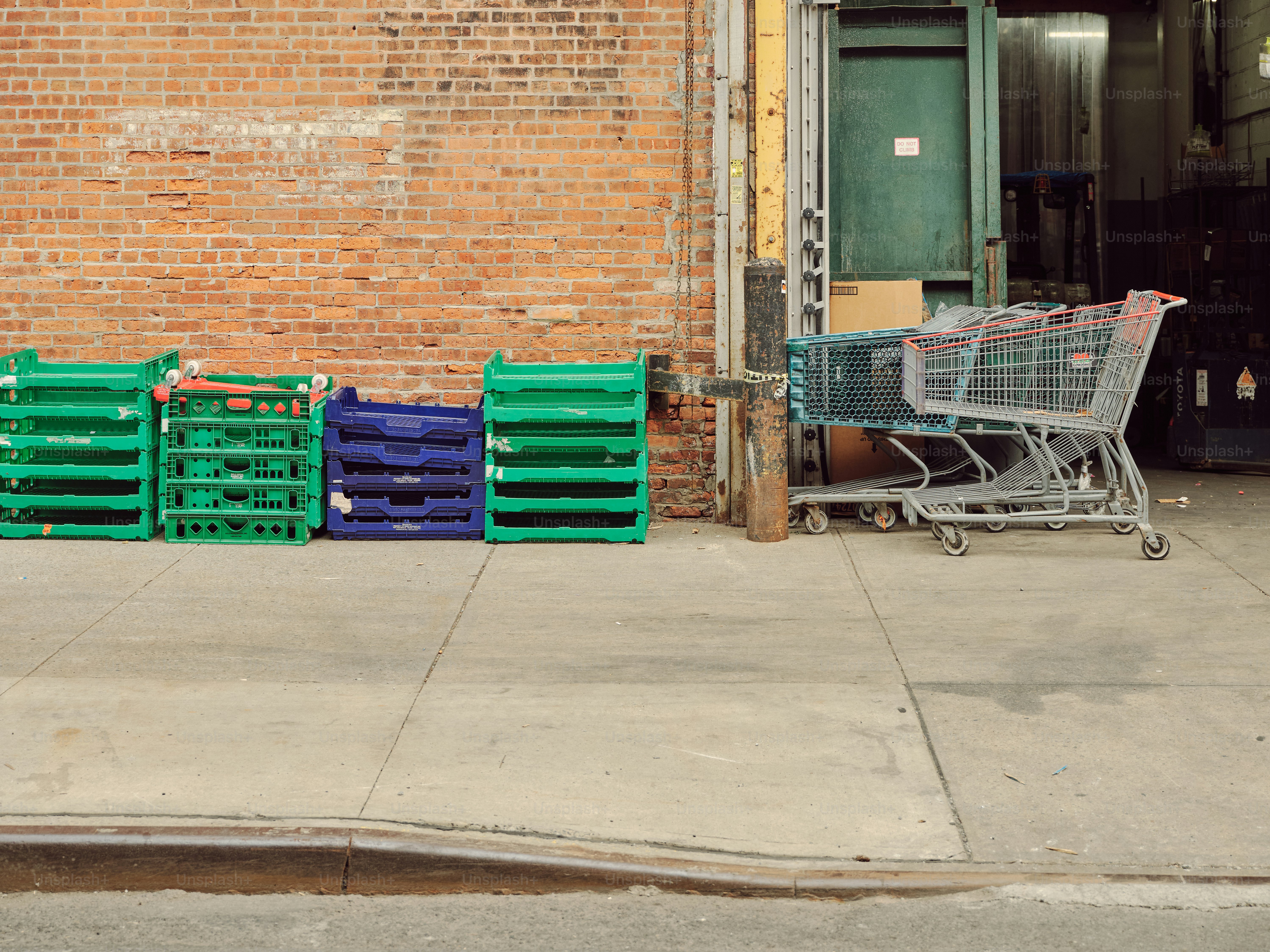 Shopping carts and crates near a loading dock. photo – City Image on ...
