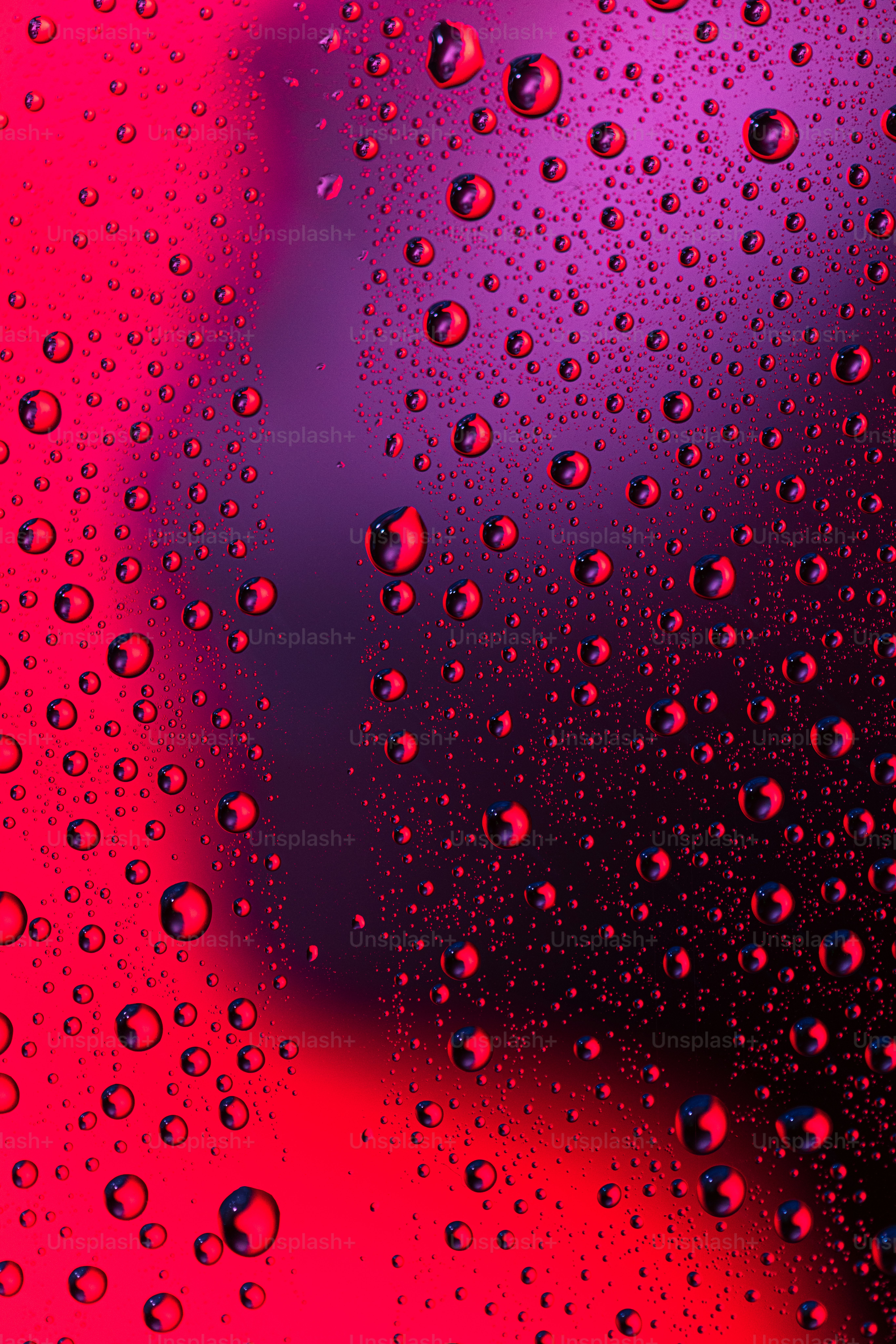 Red water droplets on a vibrant, colorful background. photo – Wallpaper ...