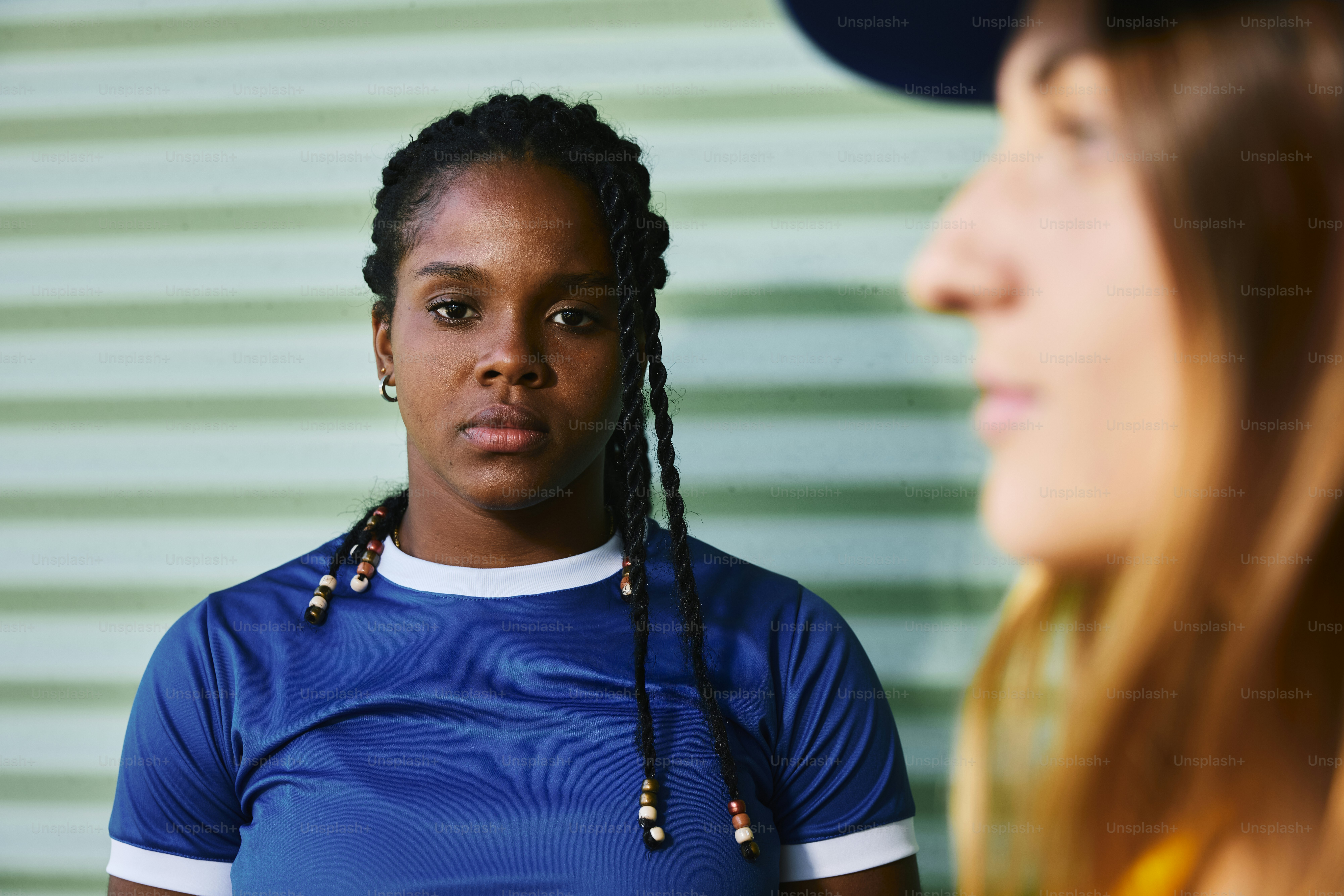 A woman stares intently at someone near her. photo – Clothing Image on ...