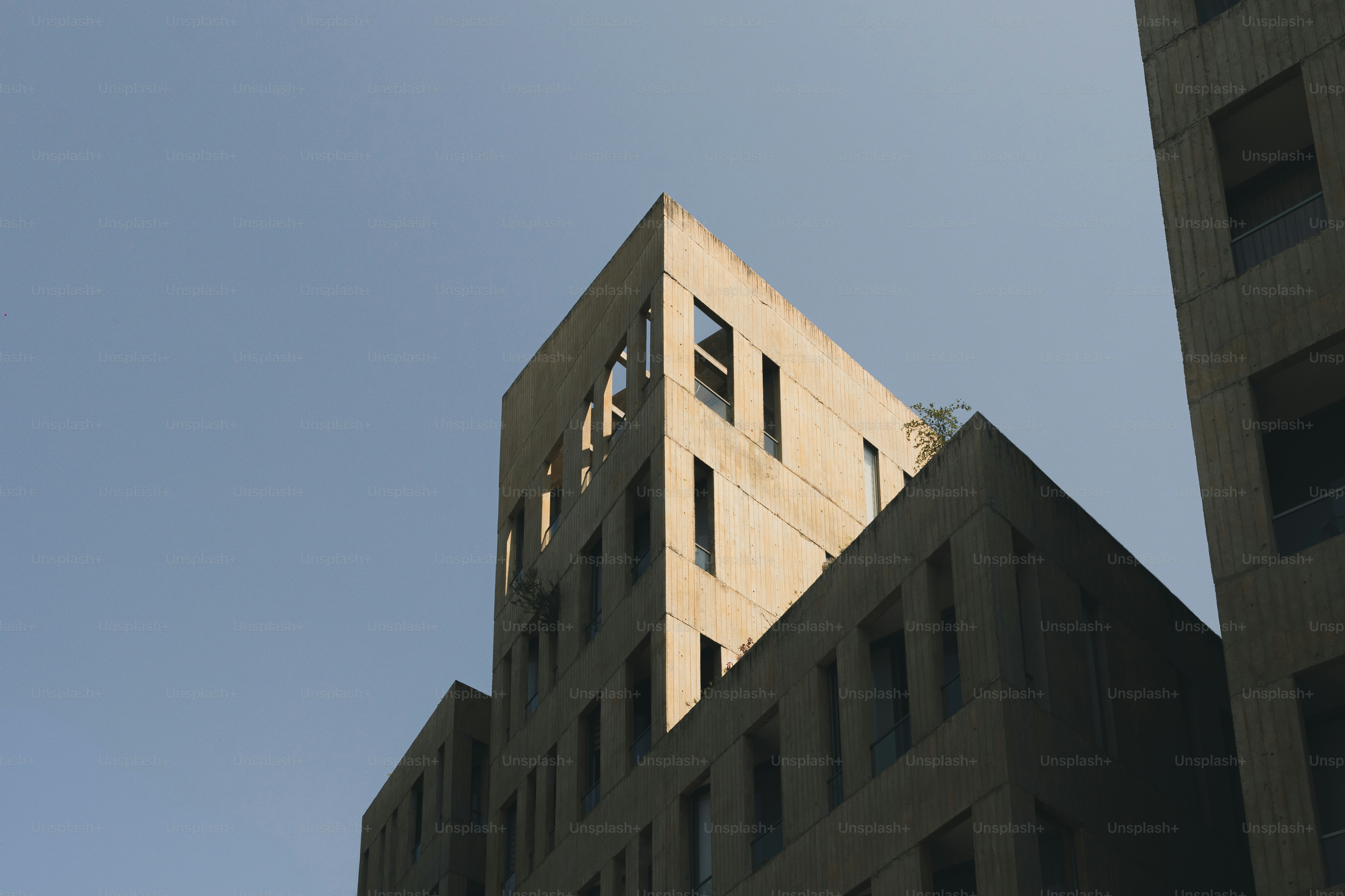 Here's a short caption for the image: modern building reaching towards ...