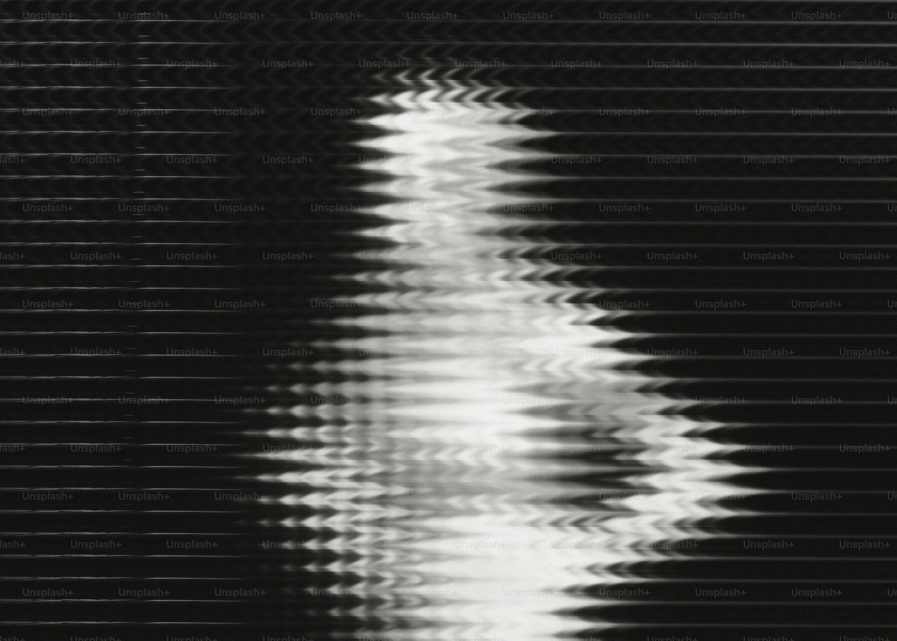 A glitchy white figure appears against black bars. photo – Pattern Image on Unsplash