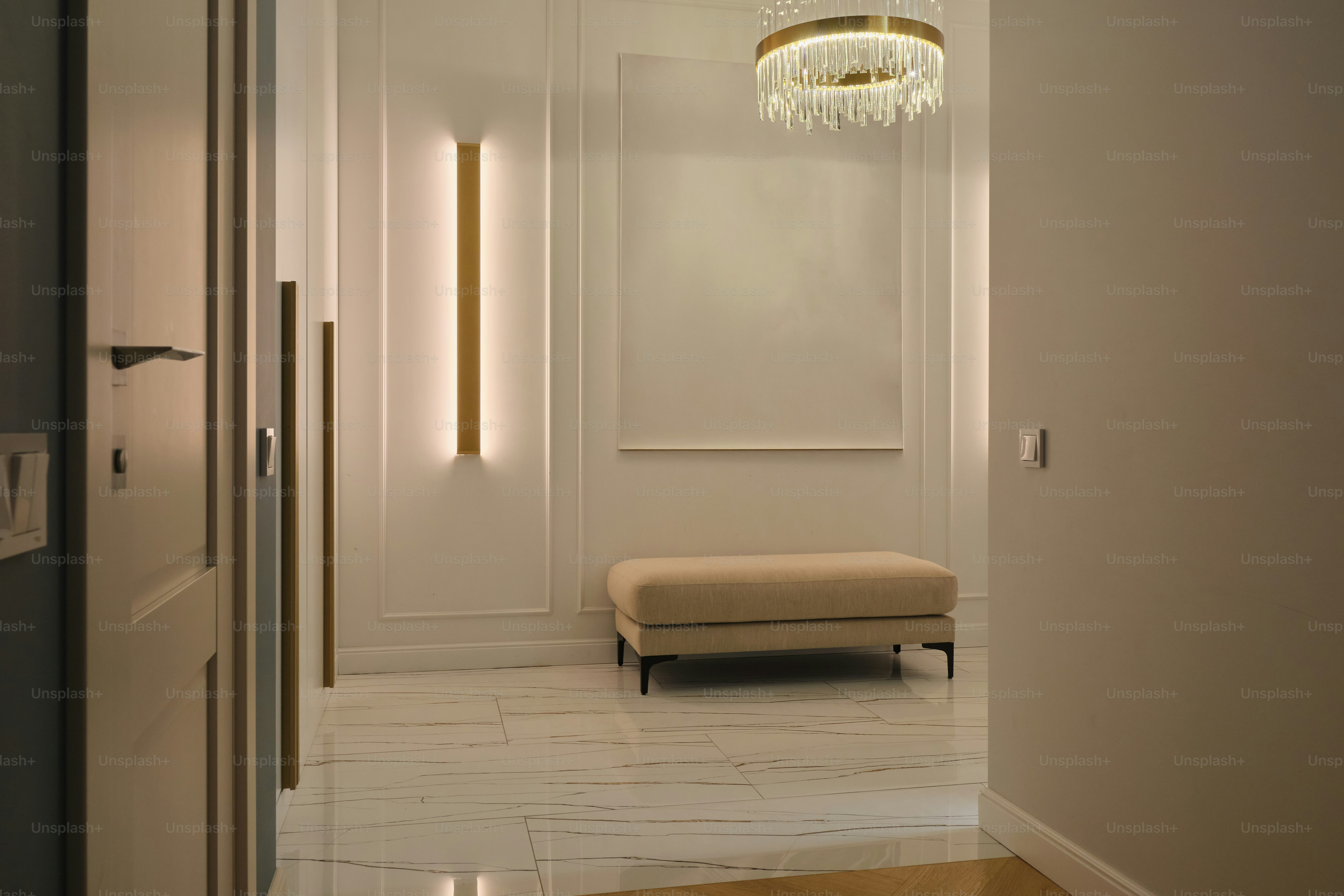 A luxurious, well-lit hallway with chic decor. photo – Architecture ...