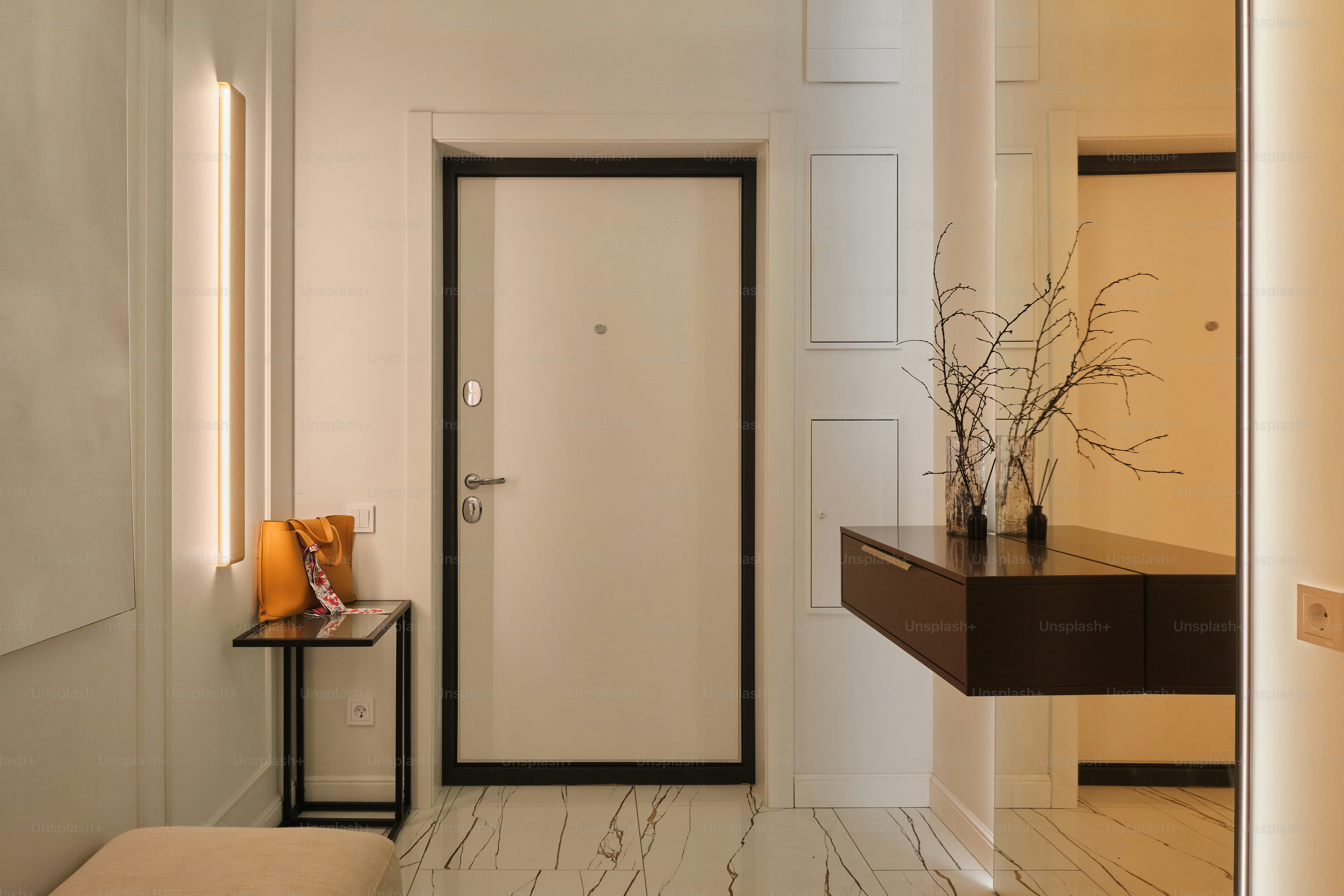 A modern hallway with a door and decor. photo – Interior design Image ...