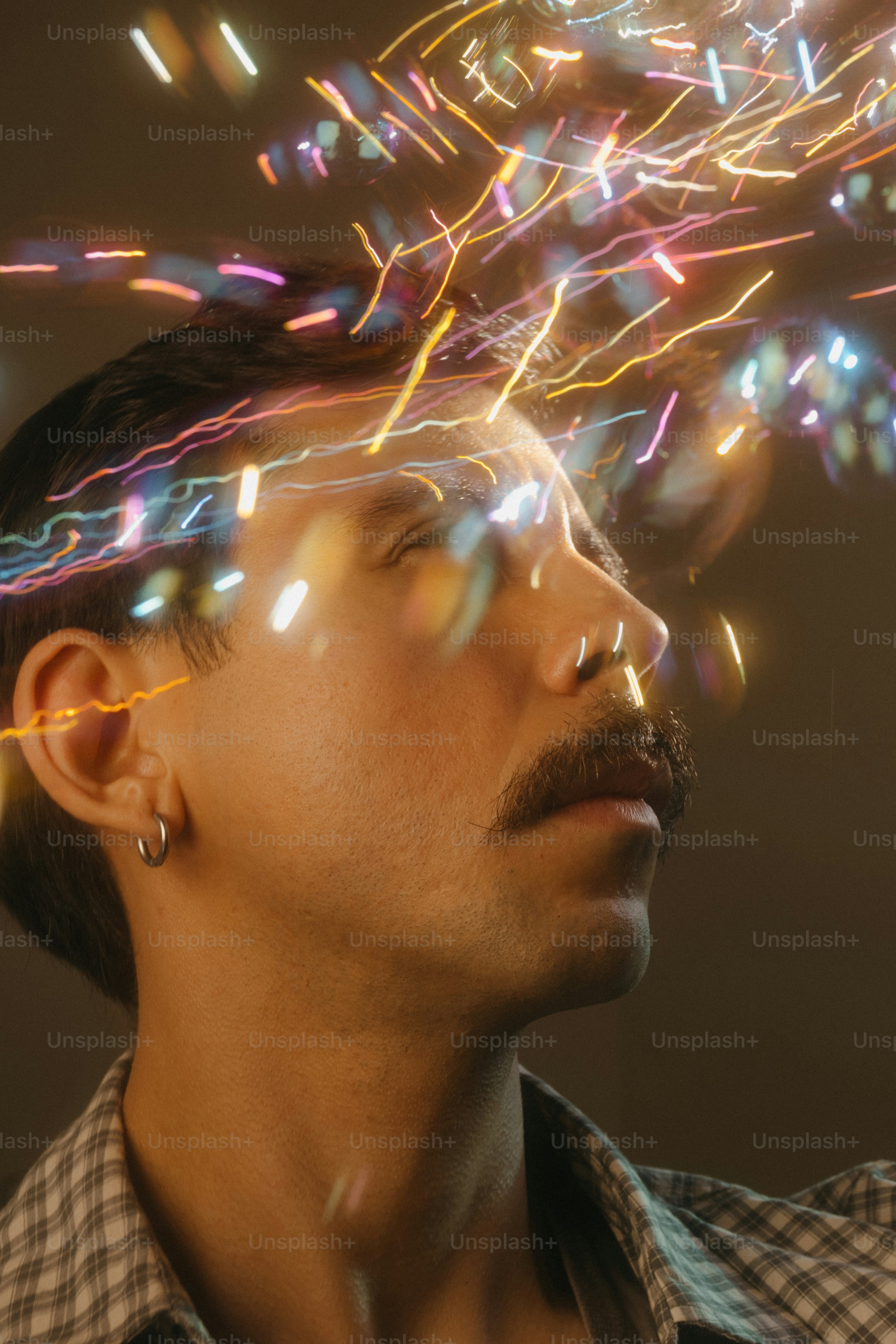 Person thinking, with bright light rays emitting. photo – Bubbles Image ...