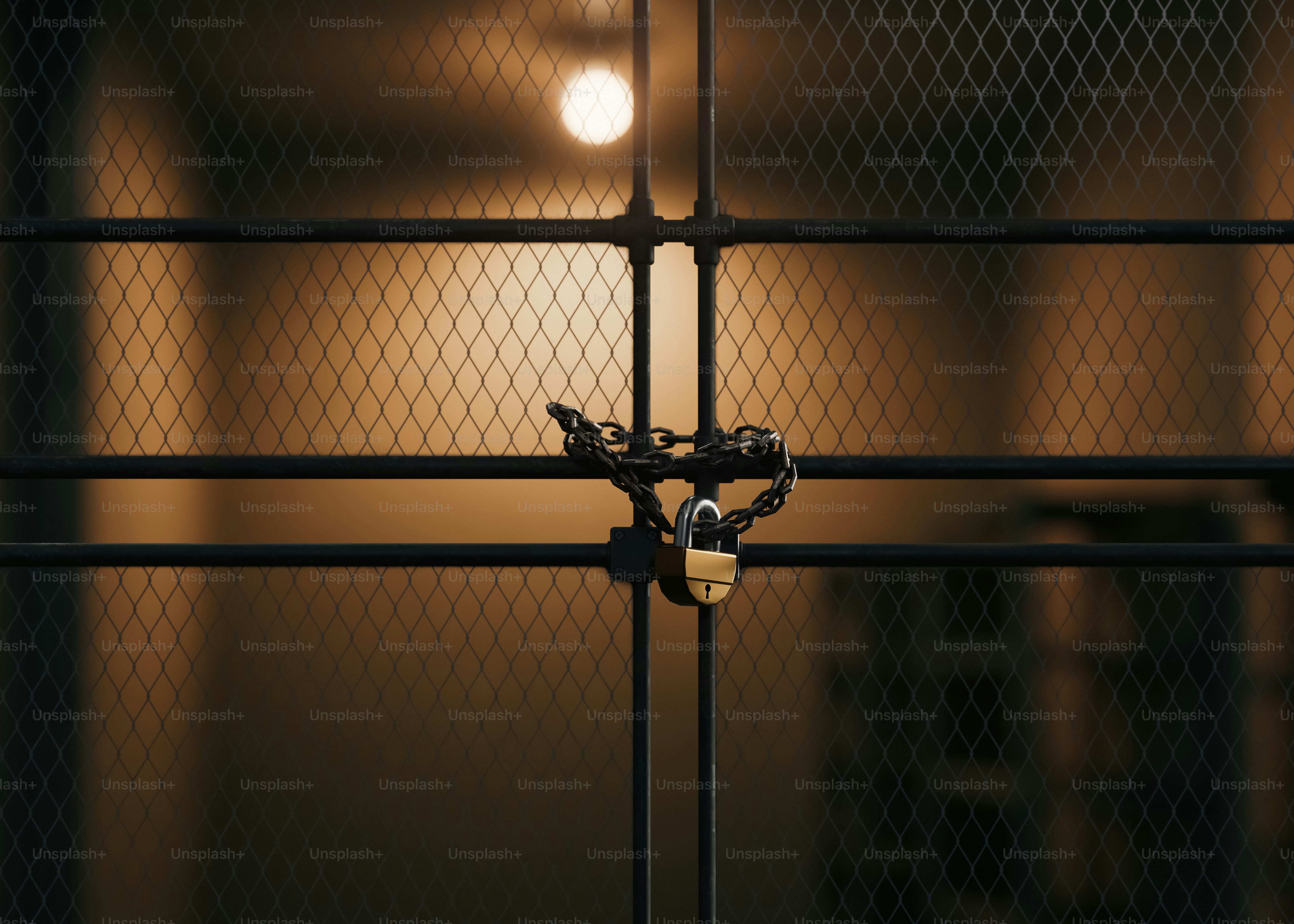 Locked gate with light in the background. photo – Night Image on Unsplash