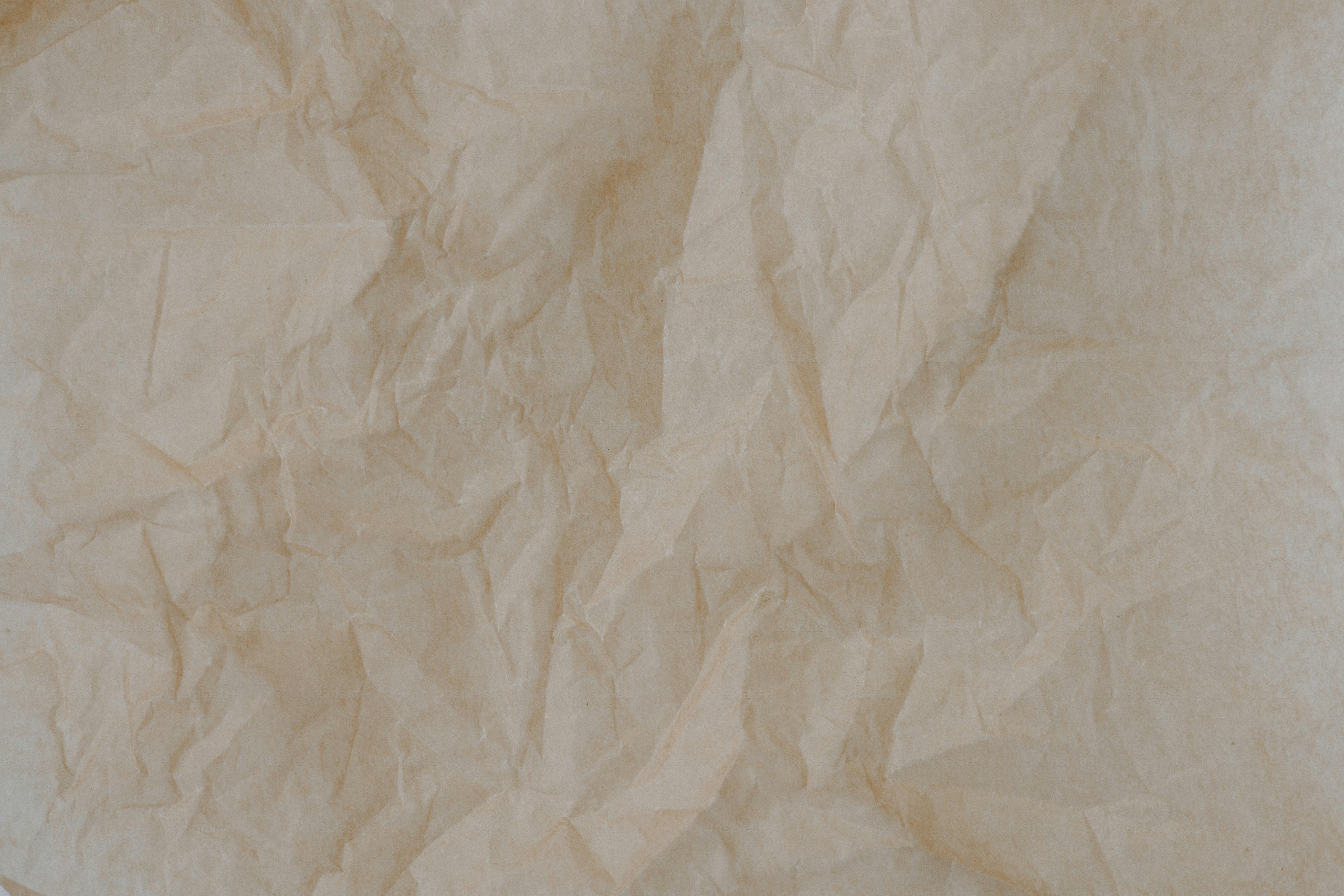 Wrinkled beige paper shows its texture. photo – Texture Image on Unsplash