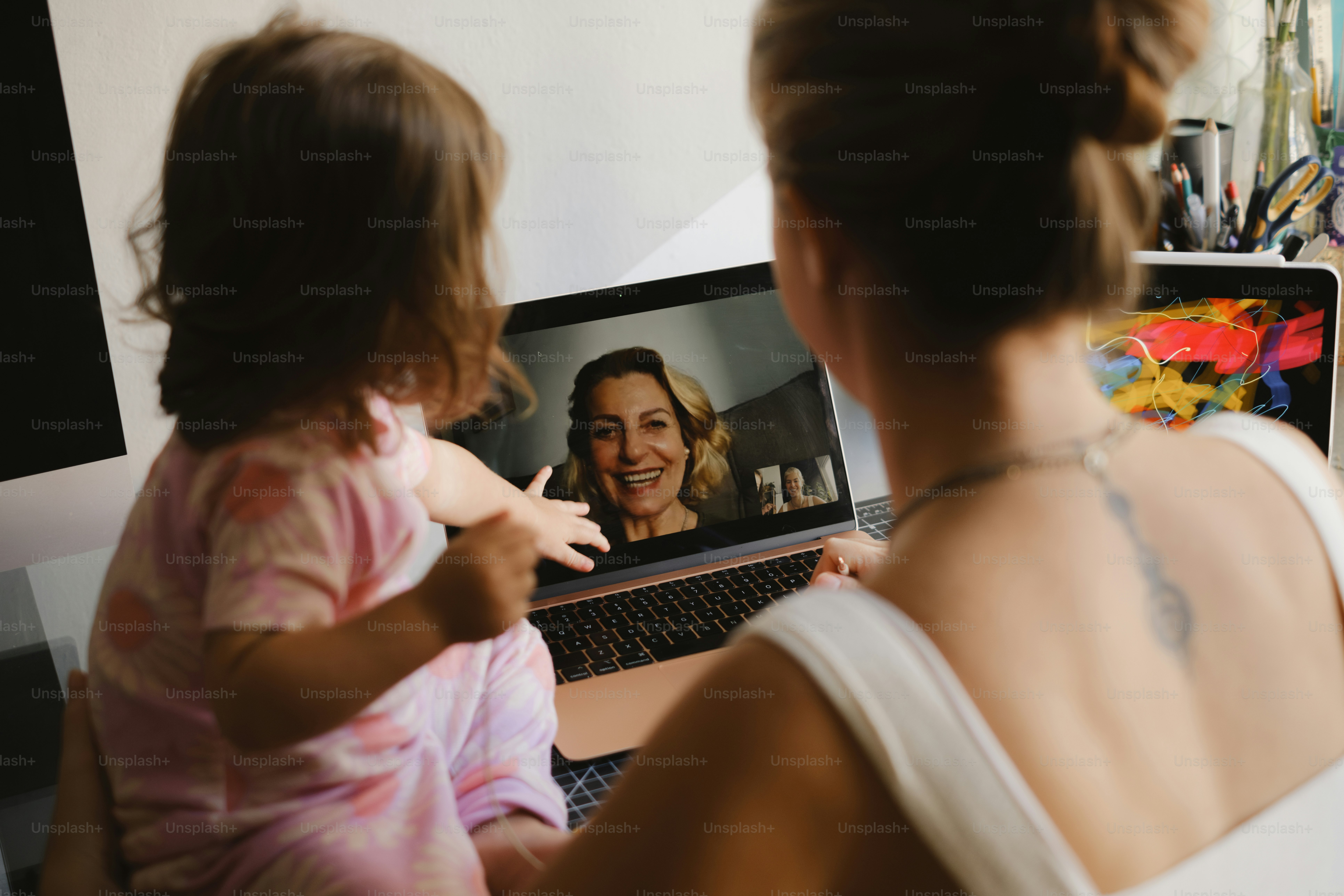 A mother and child video call with a loved one. photo – Technology ...
