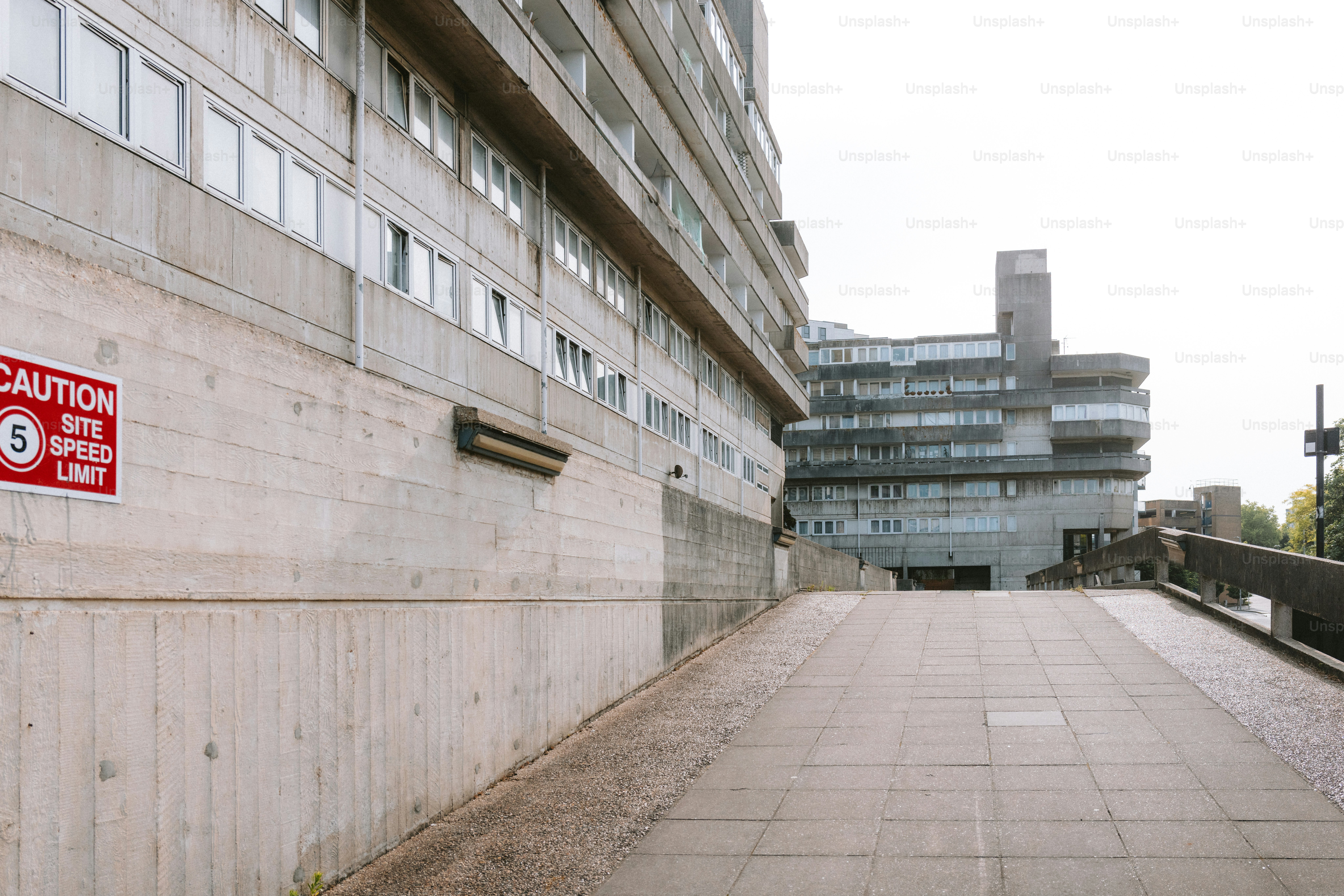 Concrete buildings with a ramp and speed limit sign. photo ...