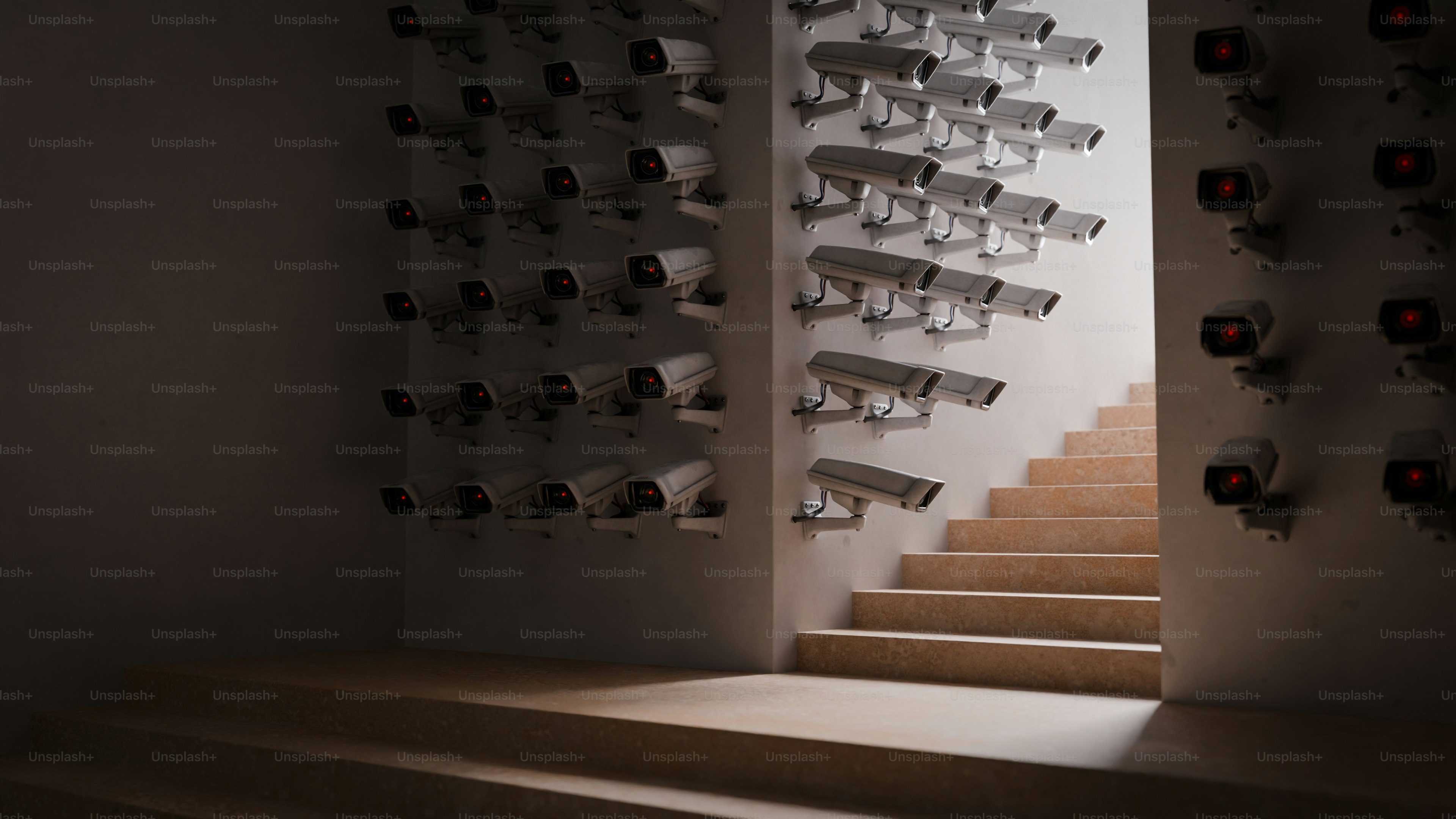 Walls covered with security cameras look over stairs. photo – Security ...